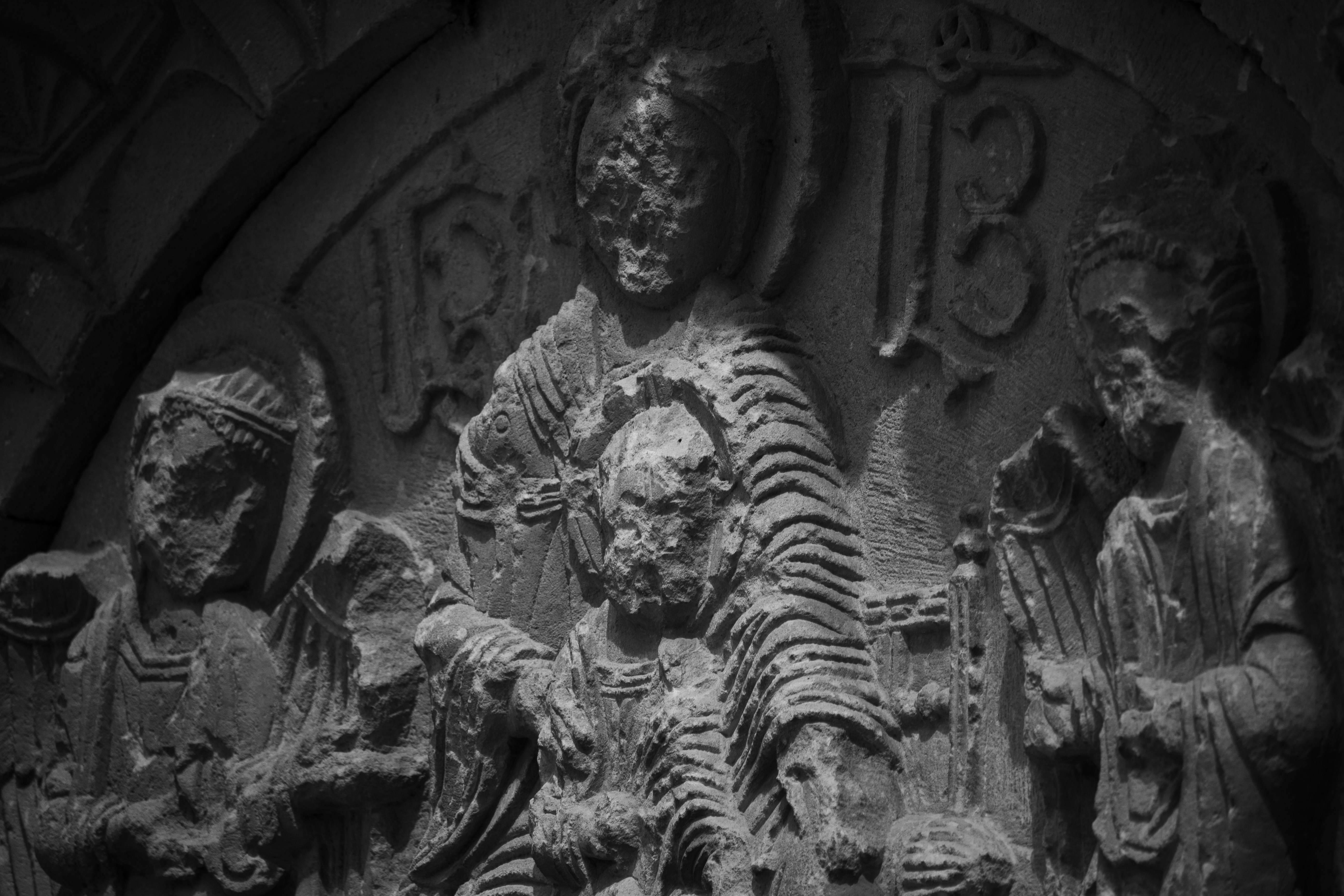 Relief of Grace: A Weathered Chronicle in Stone