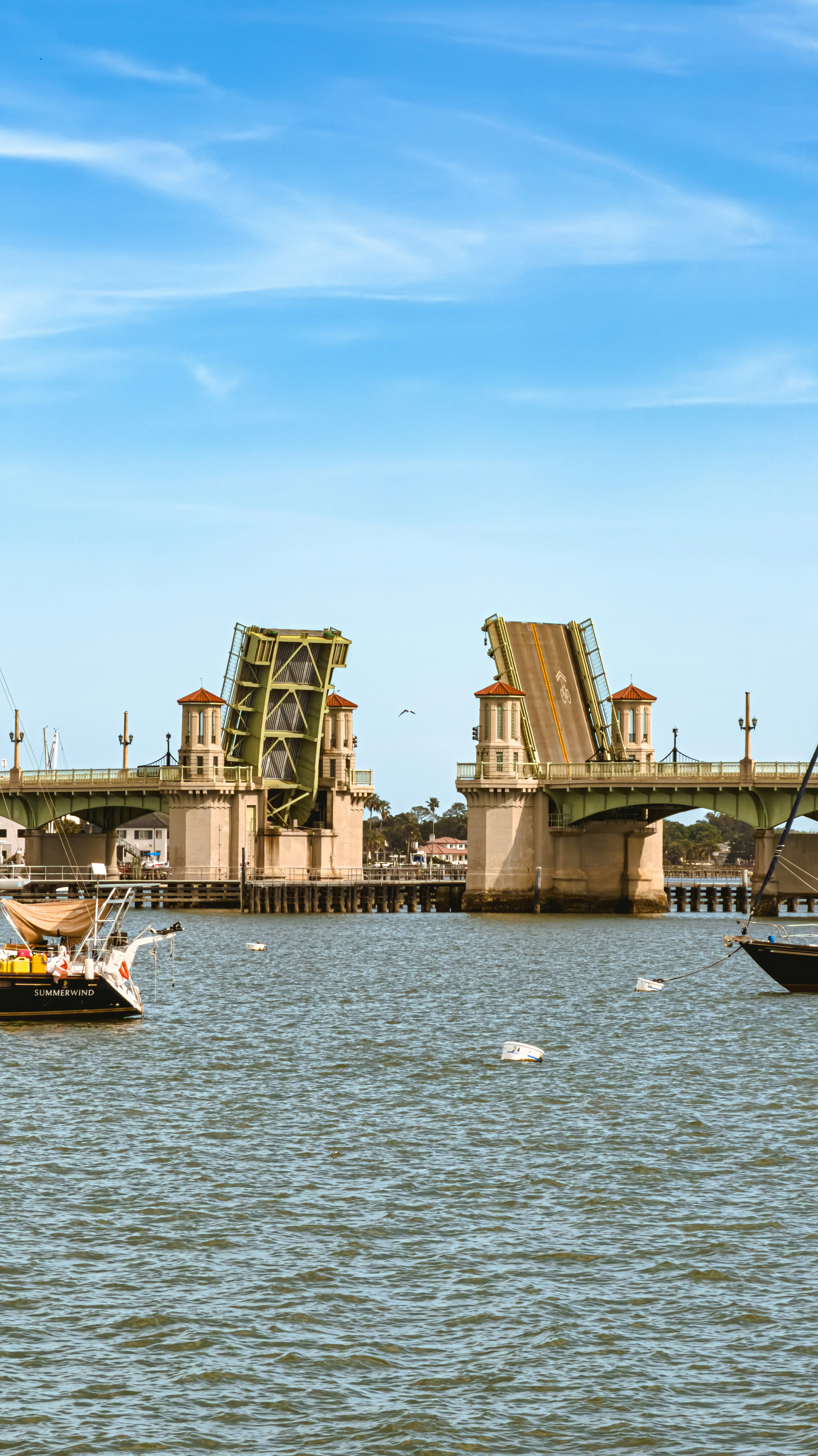 Drawbridge Dawn: Boats and a Breakaway Span Over Quiet Waters