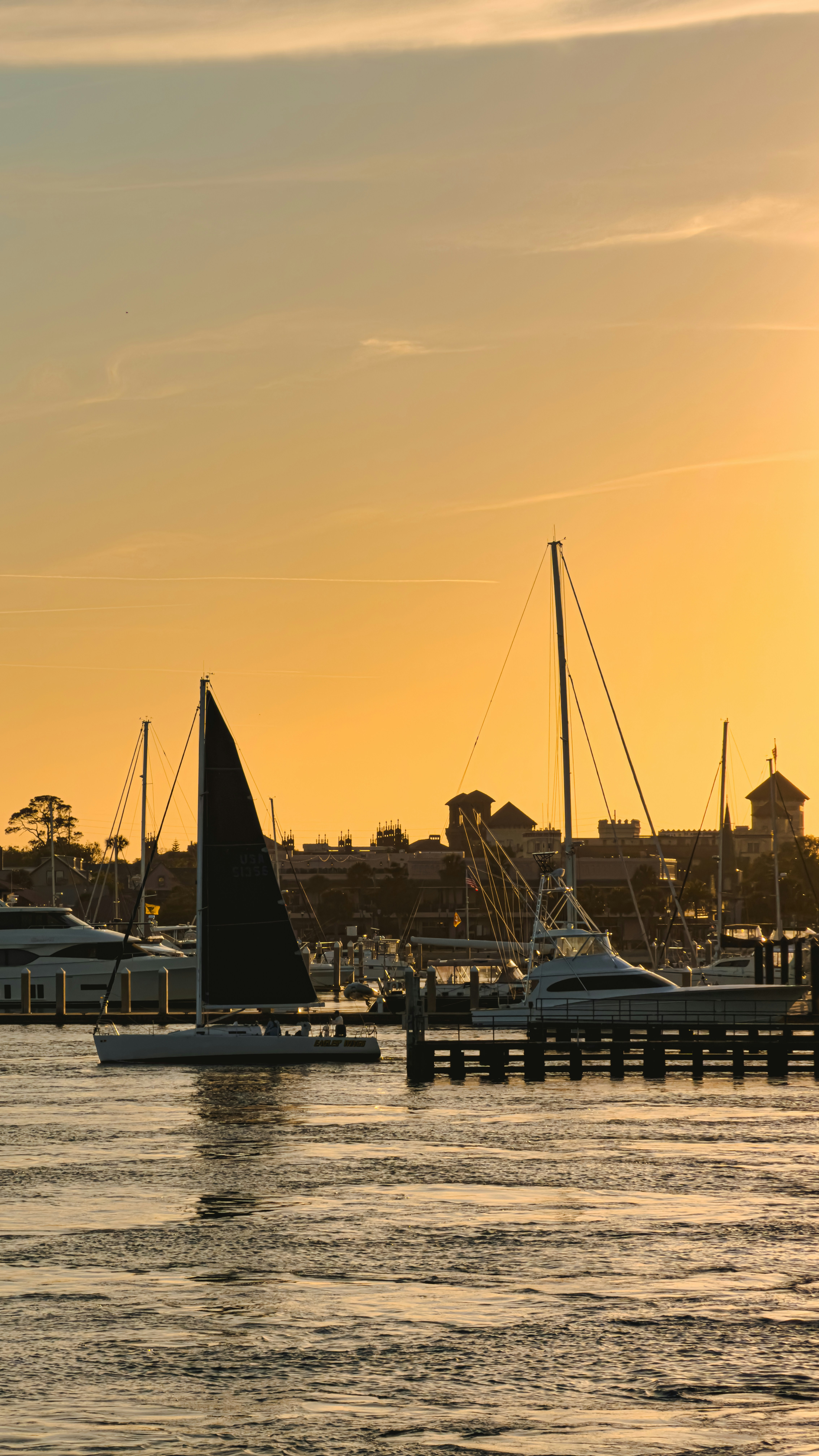 Sunset Marina Silhouettes Over Glassy Waters