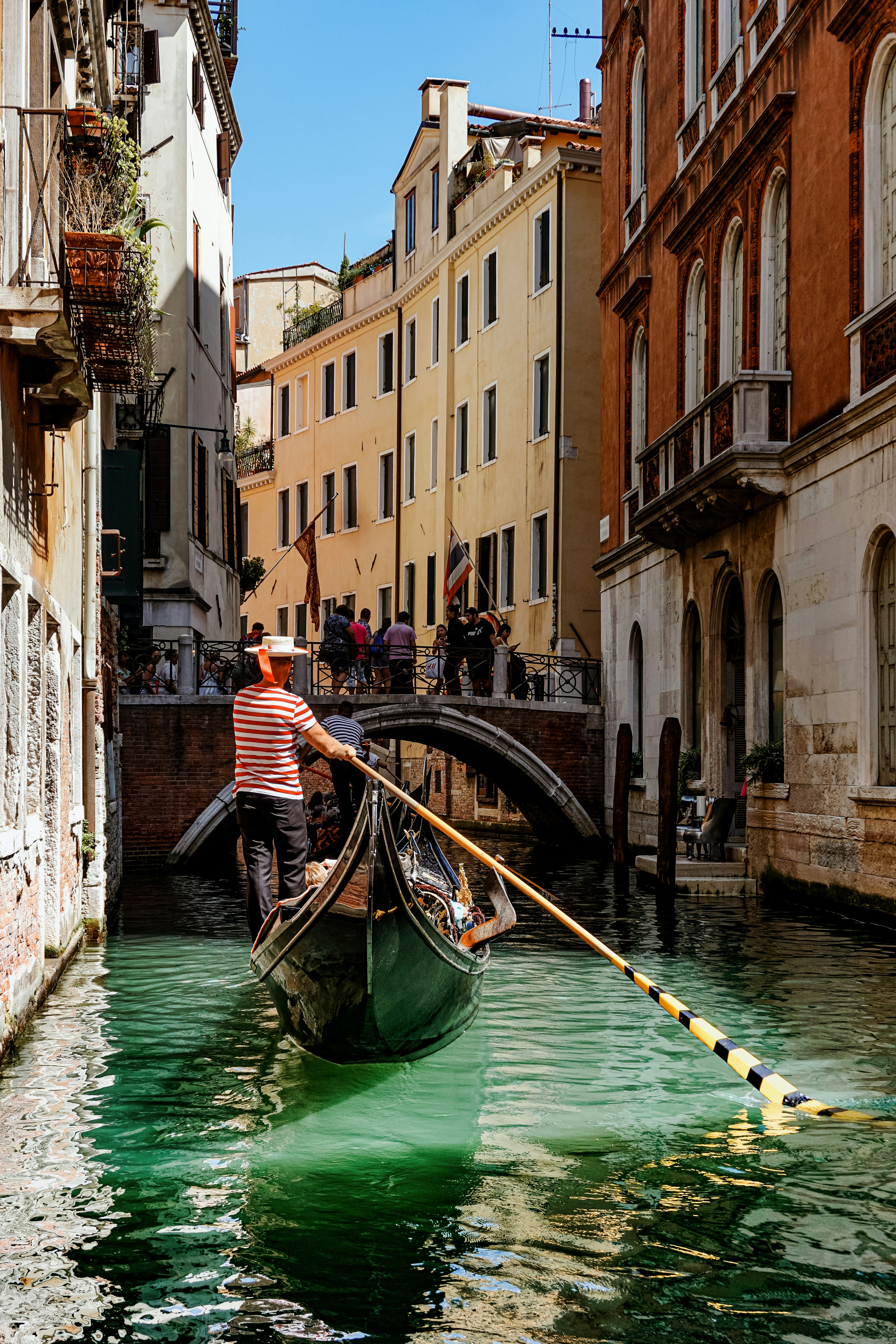 Gondola Glide Through a Sunlit Venetian Canal