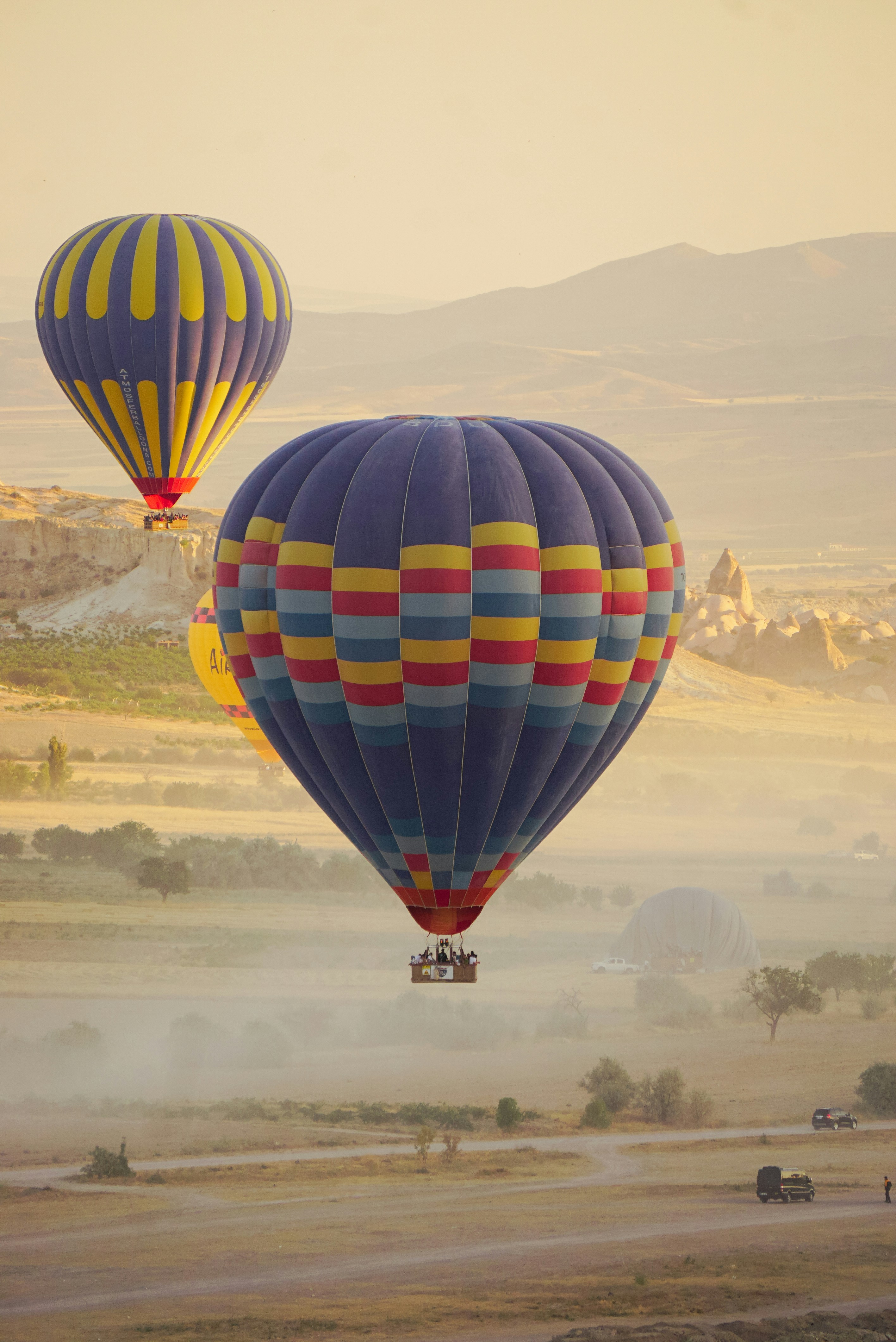 Colorful ascent: twins of the sky over a dusty valley