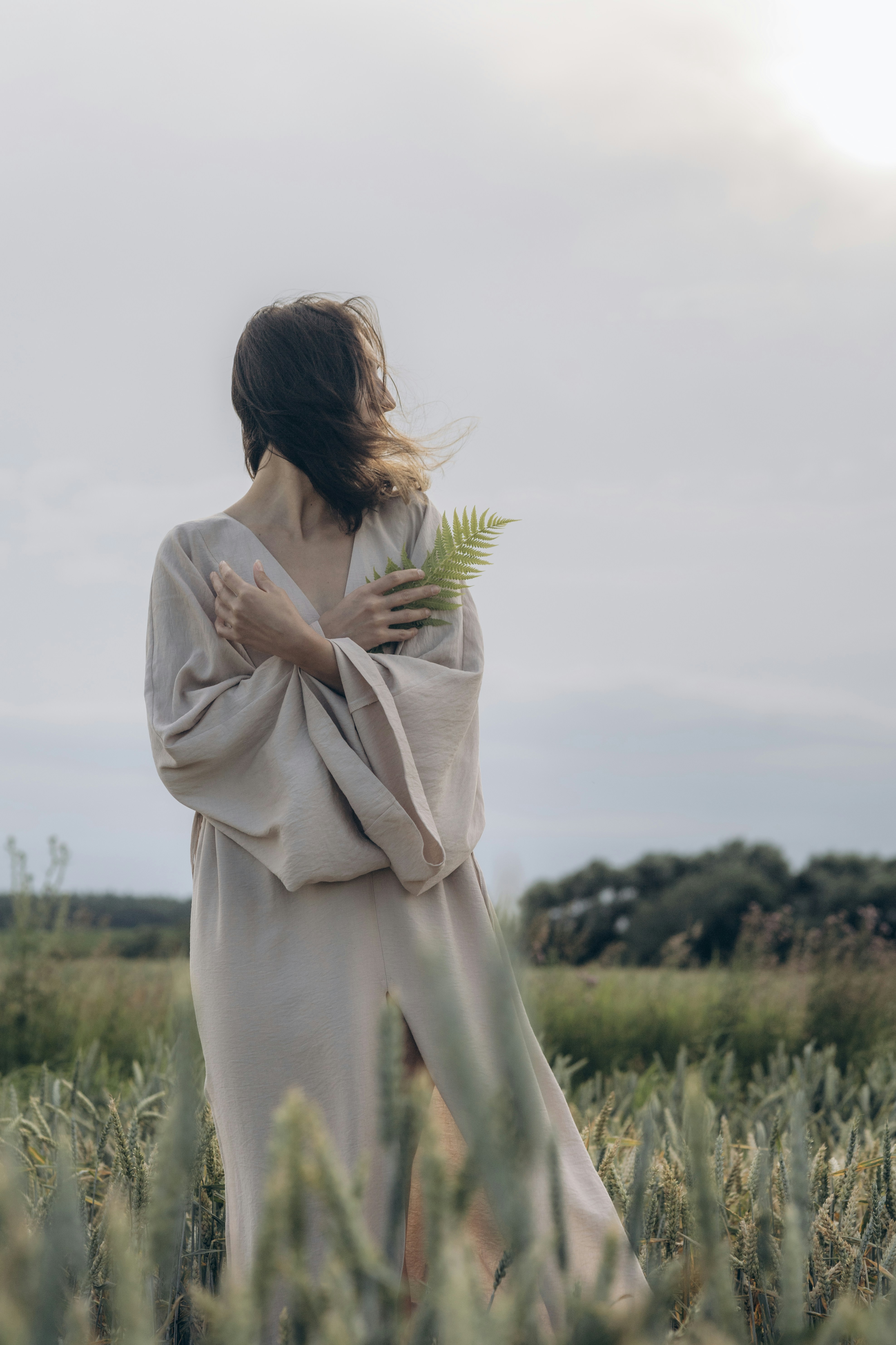 Whisper in the Field: A Figure in Pale Silk Beneath a Sky of Soft Light