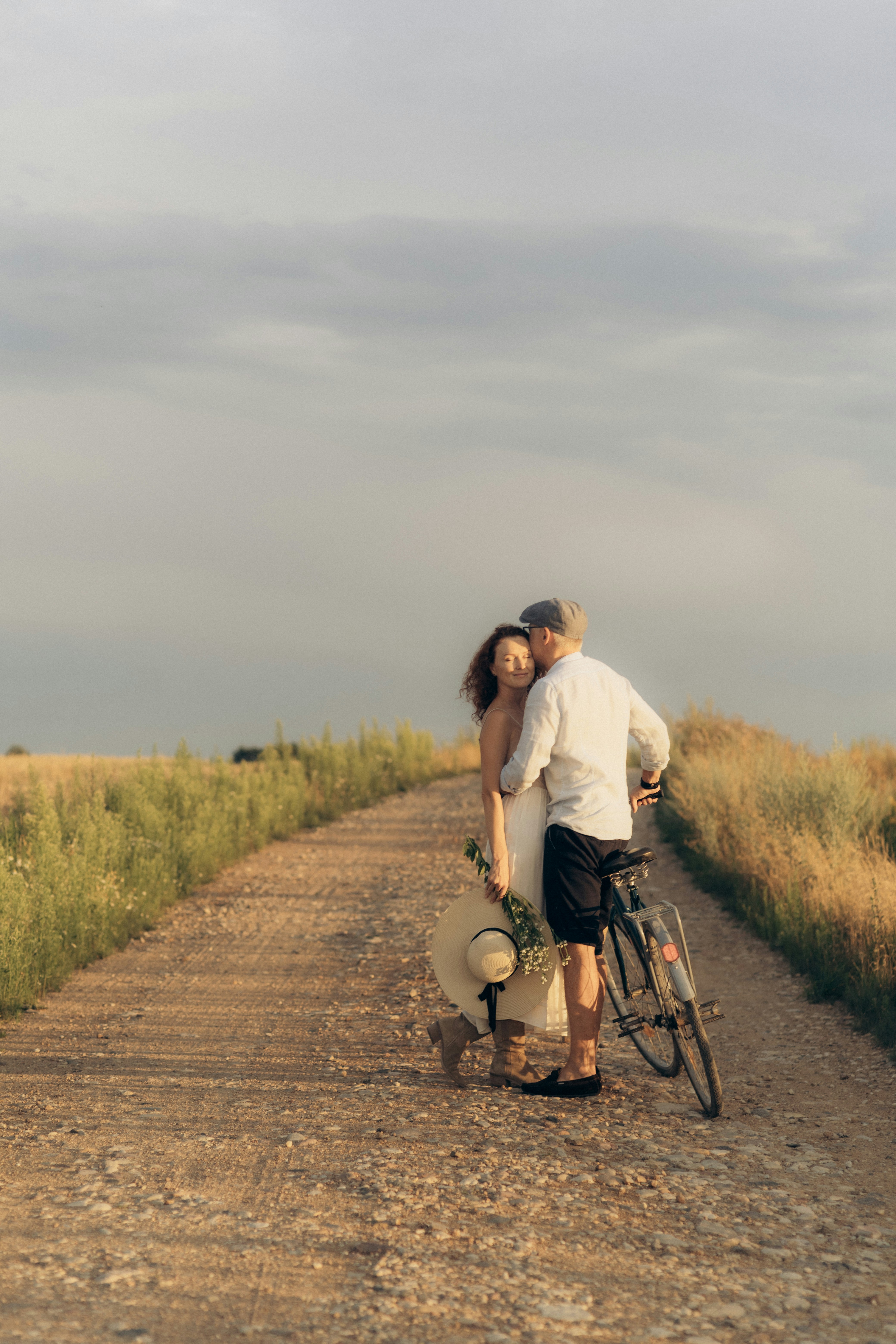Sunlit Pathway Kiss: A Quiet Moment Between Riders