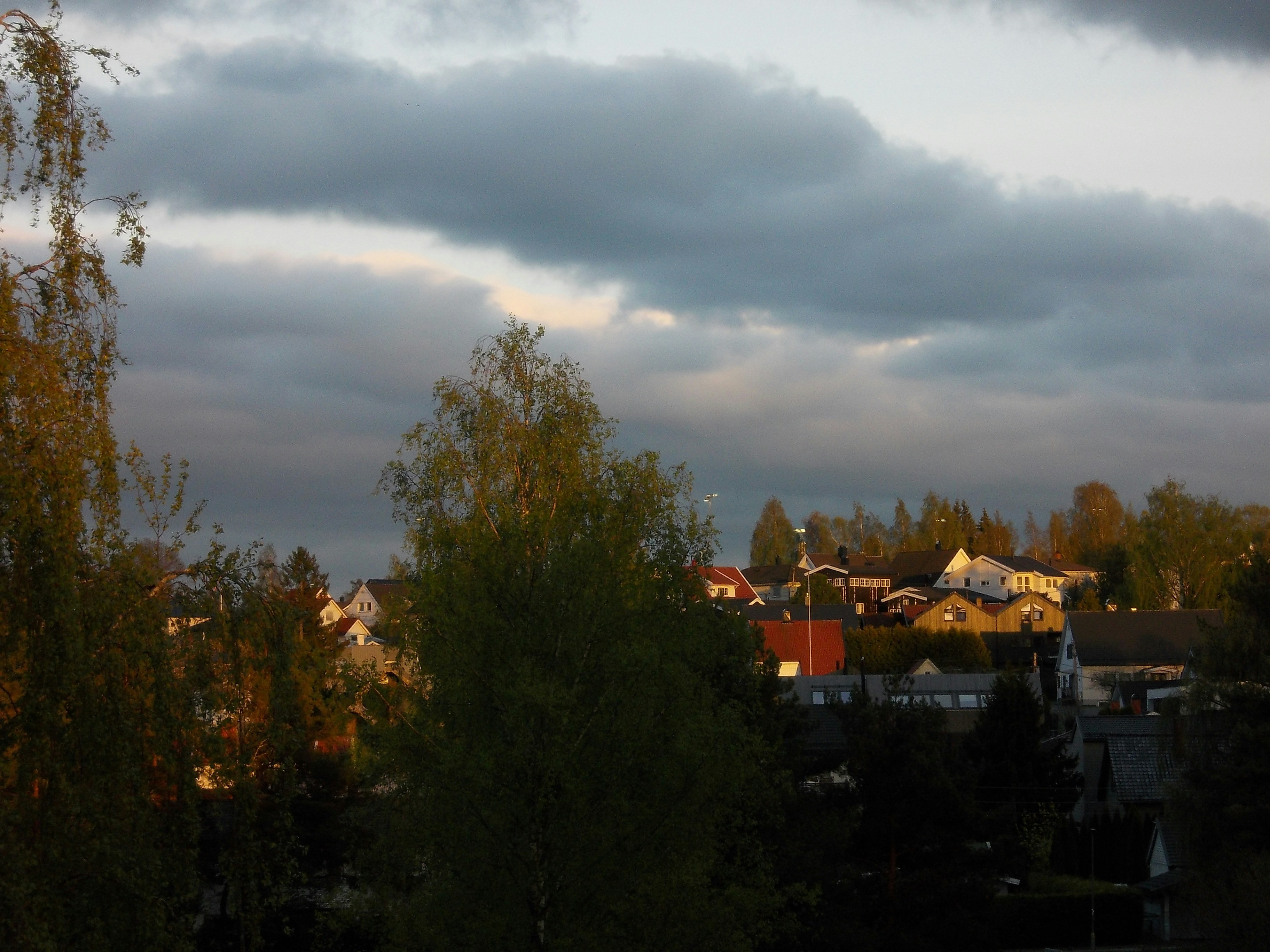 Autumn Village Beneath a Dappled Sky