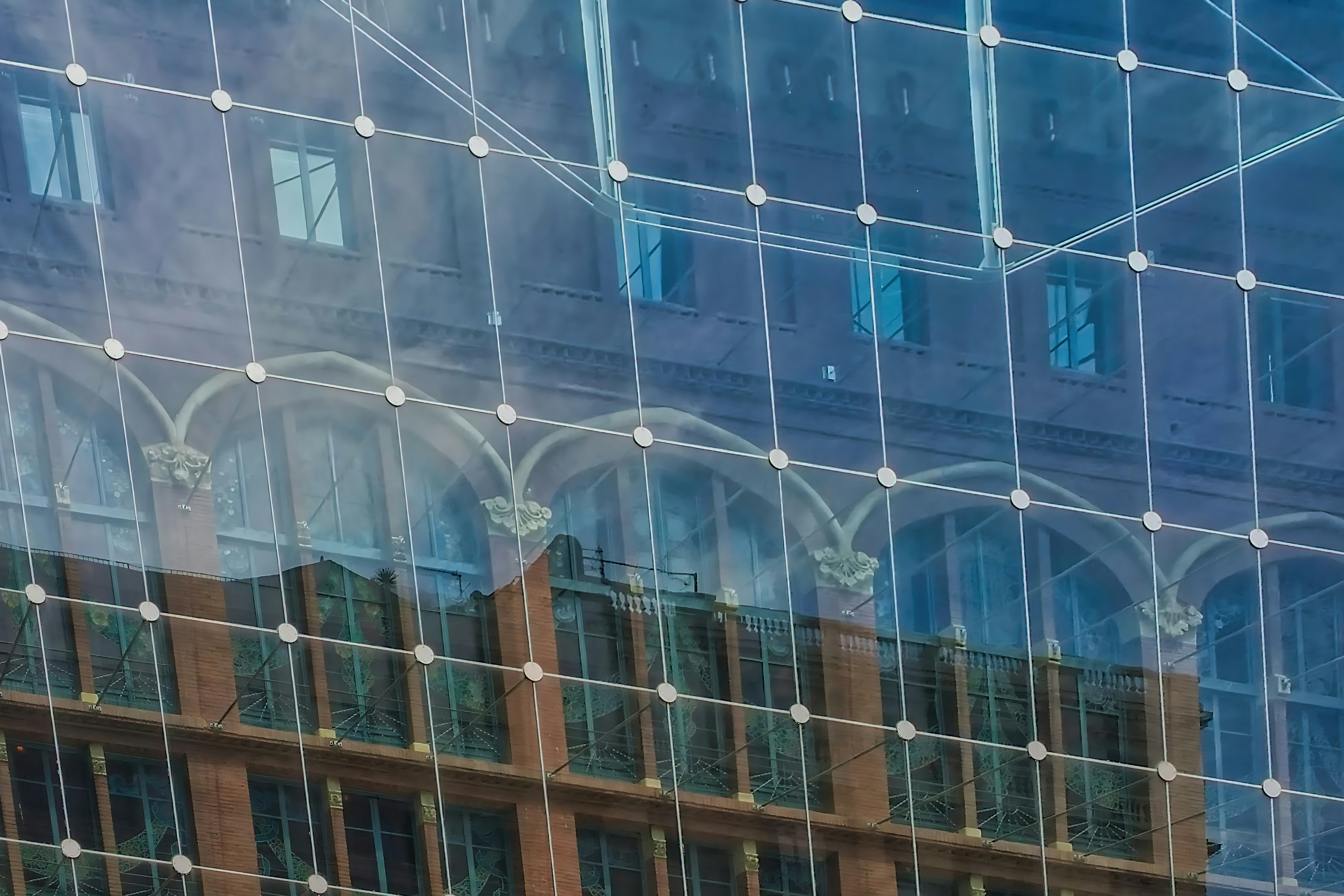 Reflections on a Grid: City Facade Through Glass