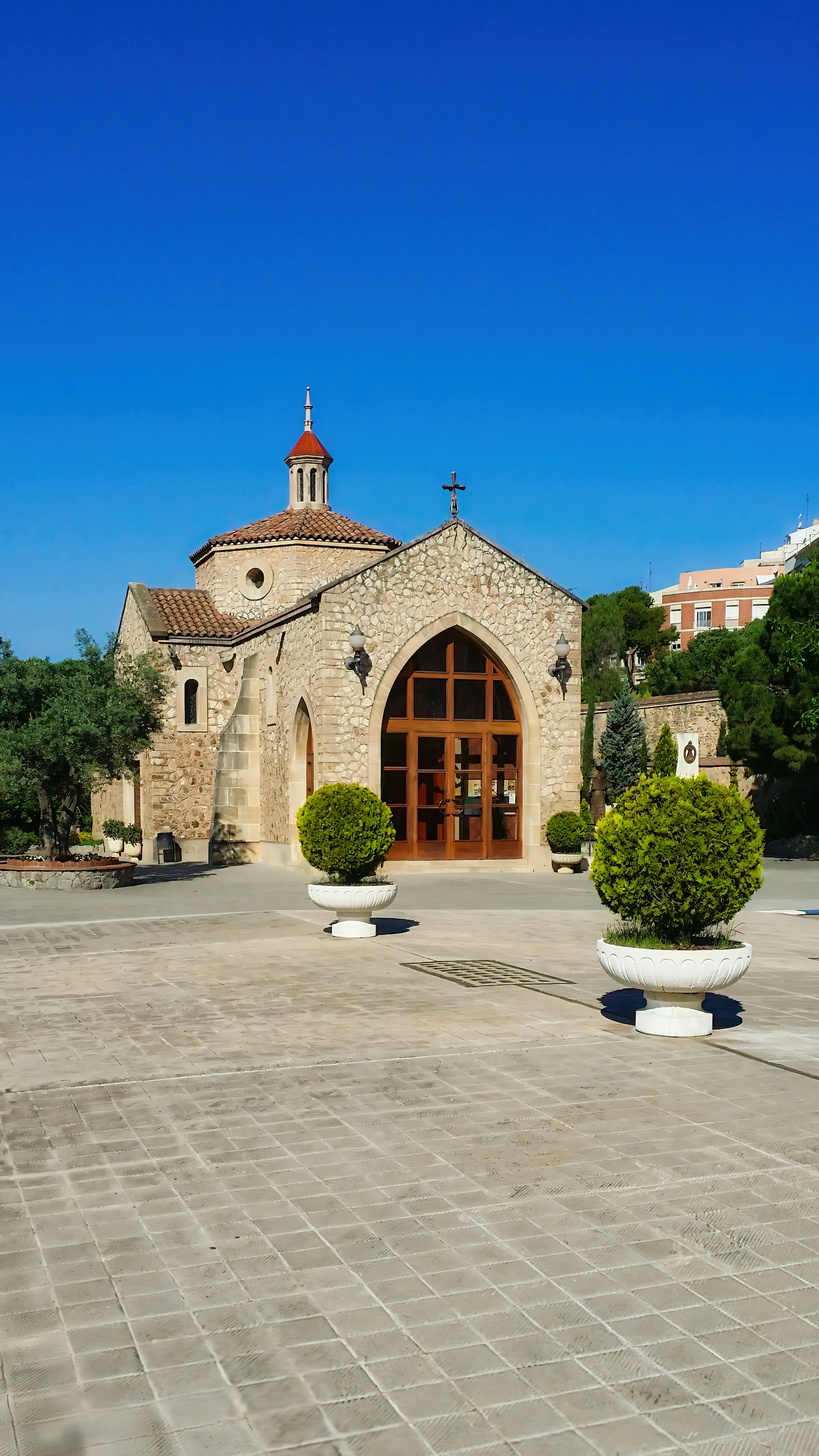 Stone Chapel at the Plaza: A Quiet Church Beneath a Cobalt Sky