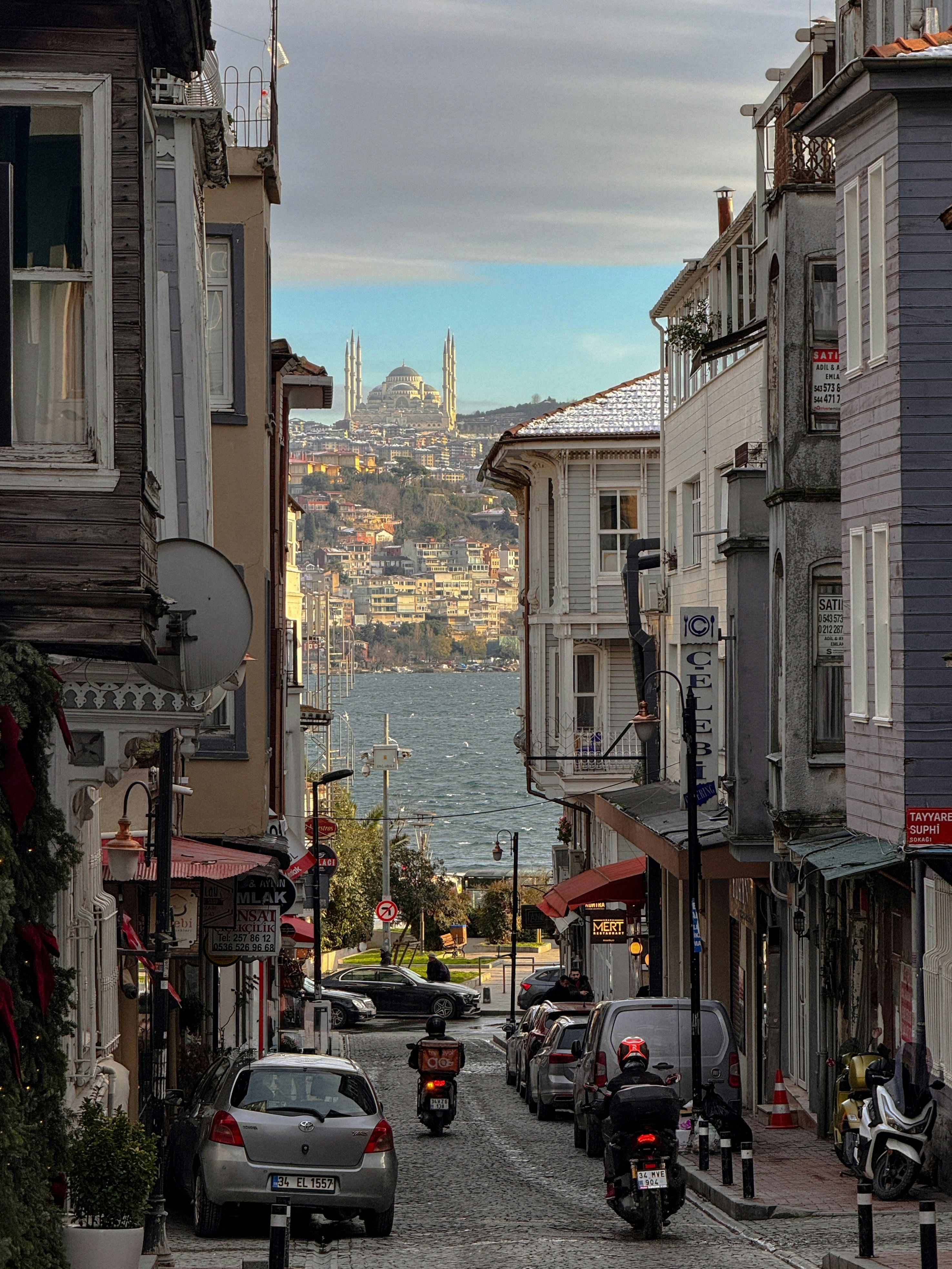 Cobbled Street to the Bosphorus: A City Leading to a Mosque Vista