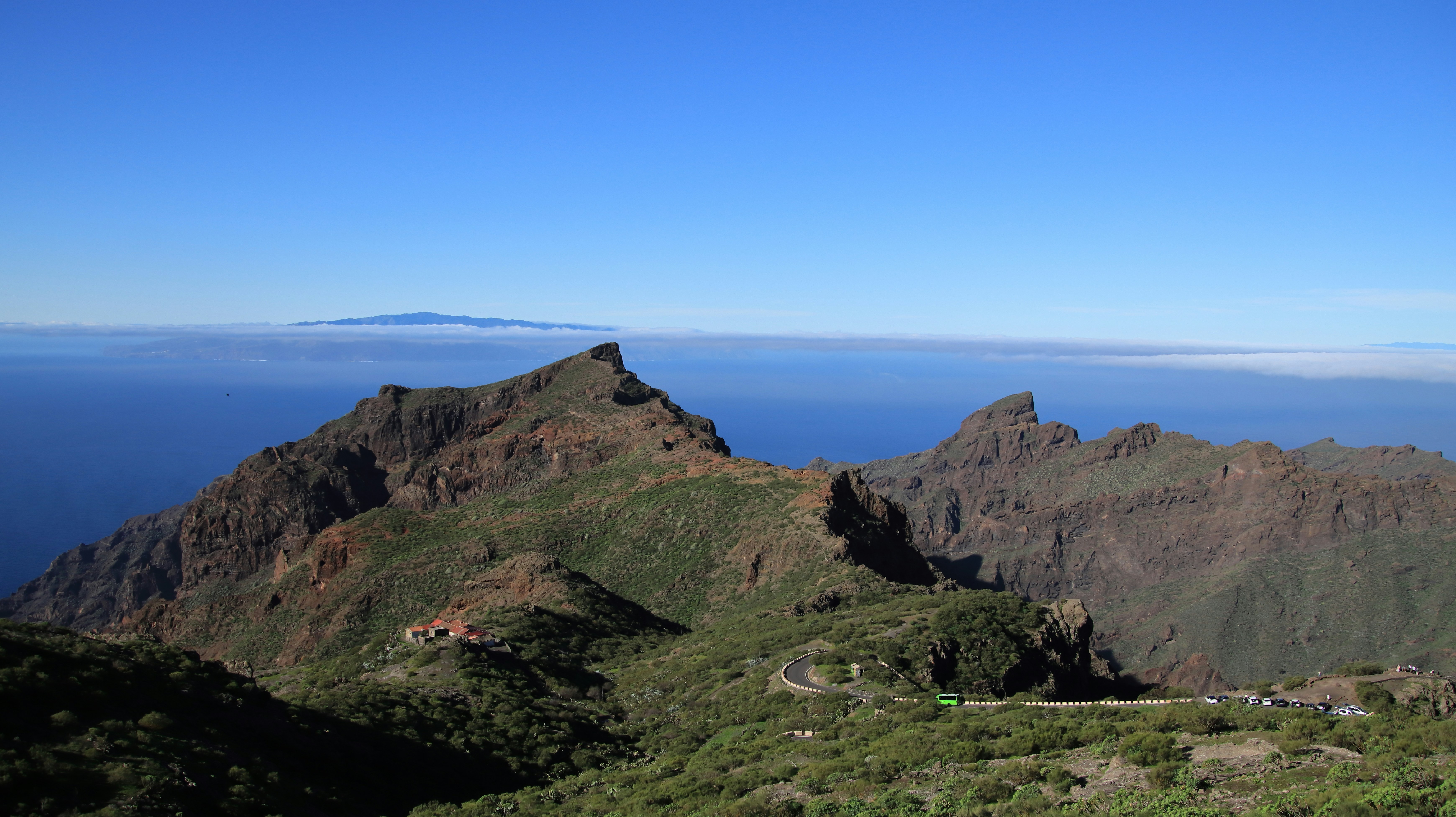 A ridge and sea horizon: volcanic coast under a crisp blue sky