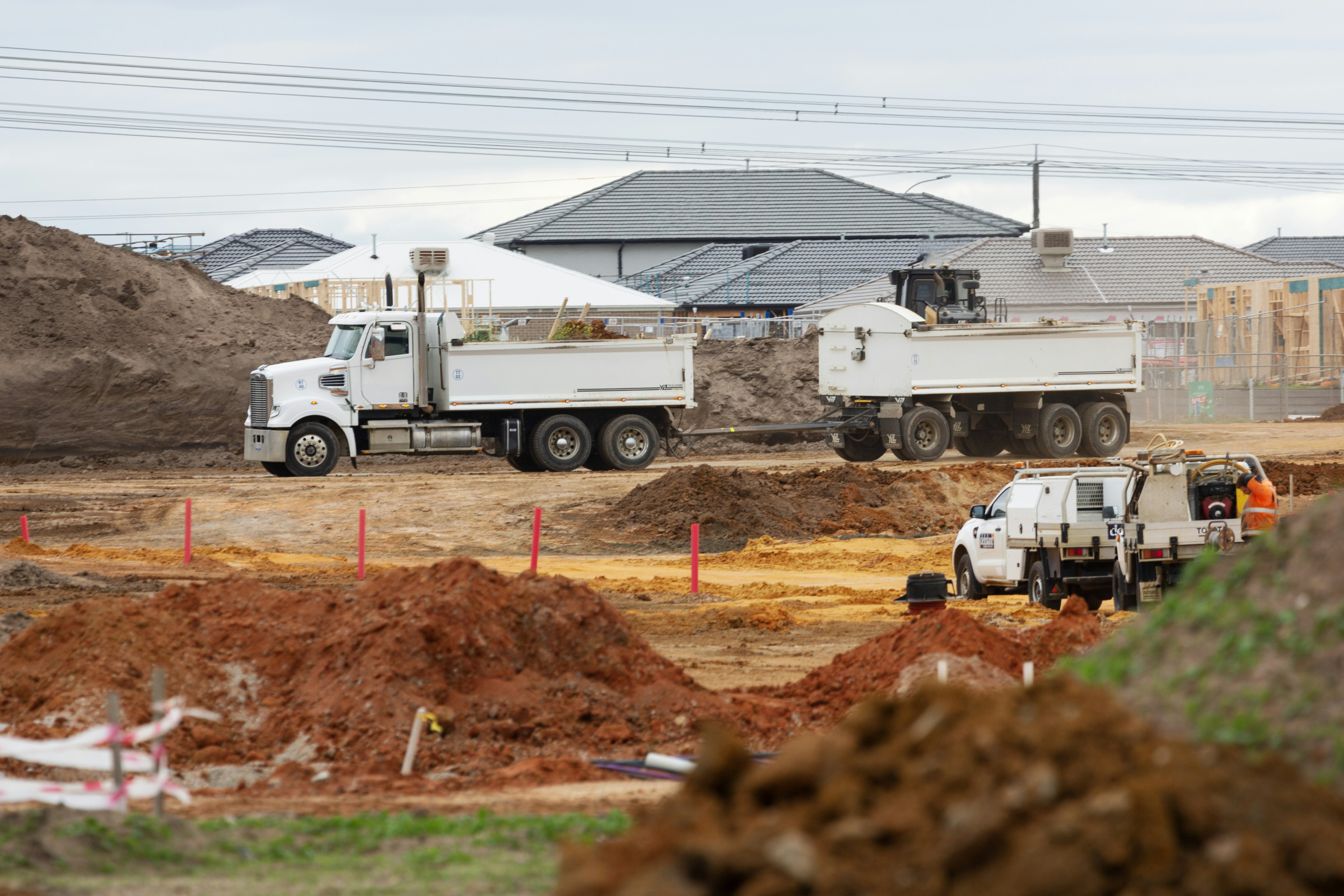 Dump Trucks at a Busy Construction Bend