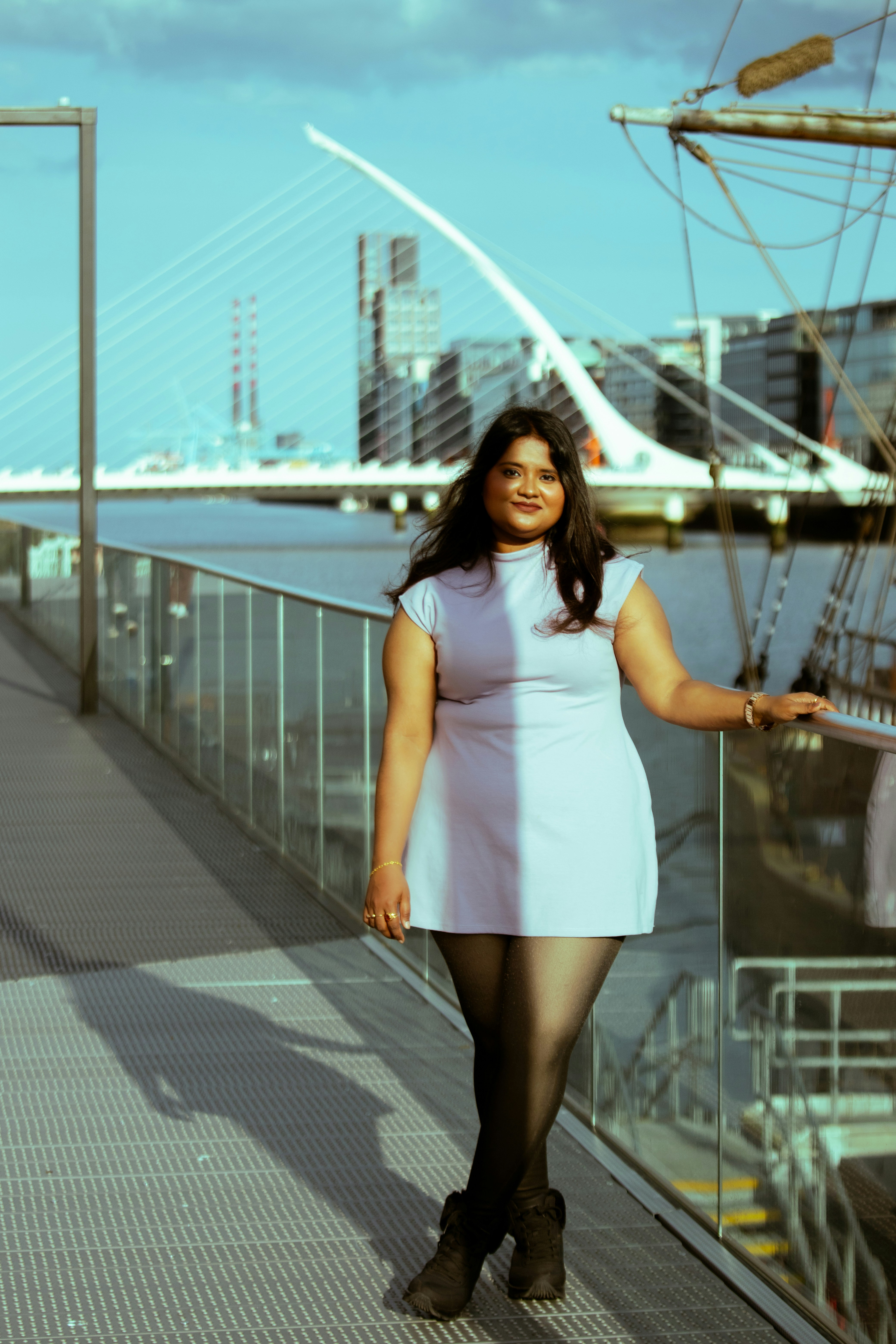 On the Riverside Walk: A Portrait Against the City Arc