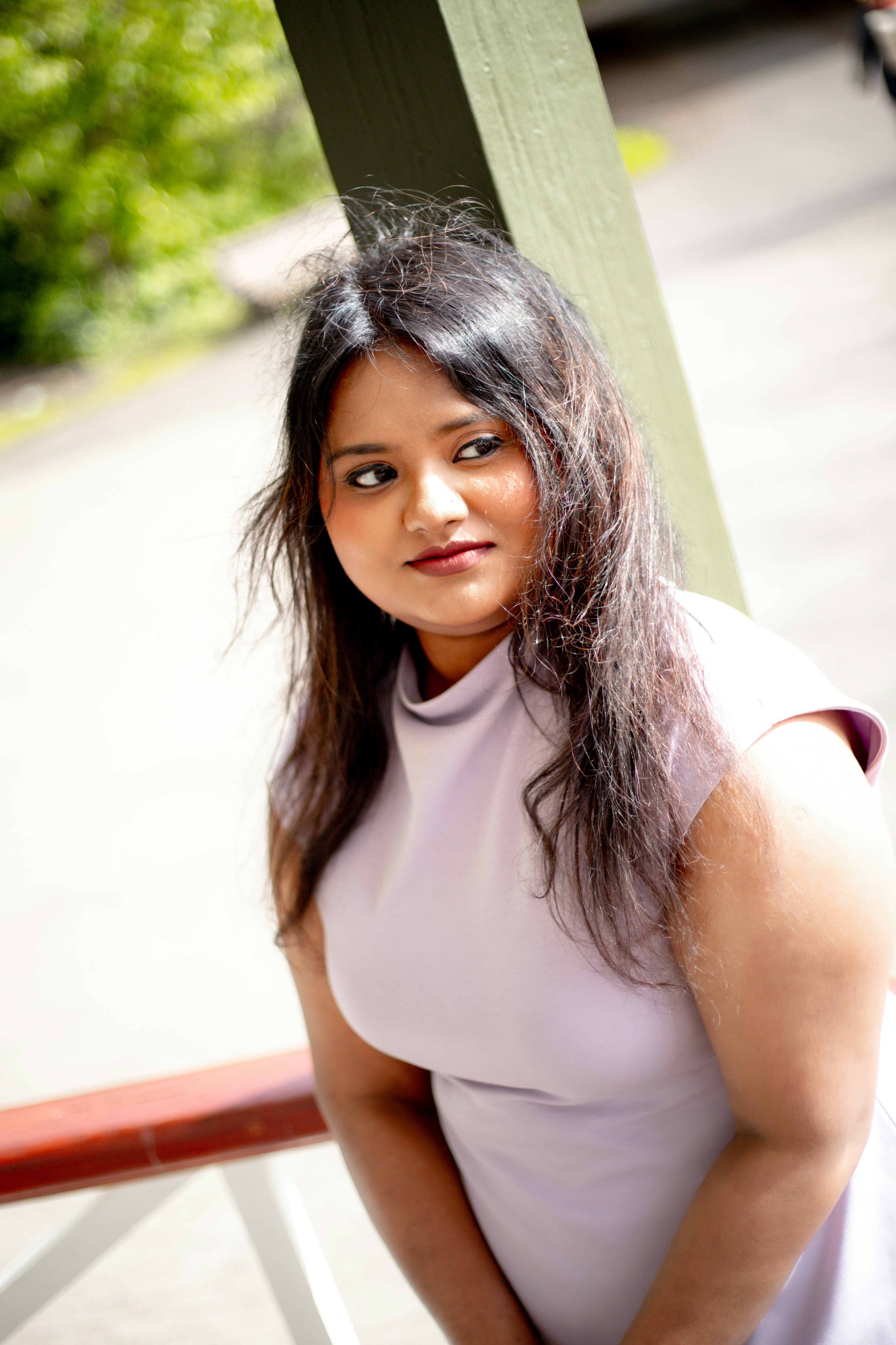 Soft Light and Strong Gaze: Portrait Beneath a Park Pergola