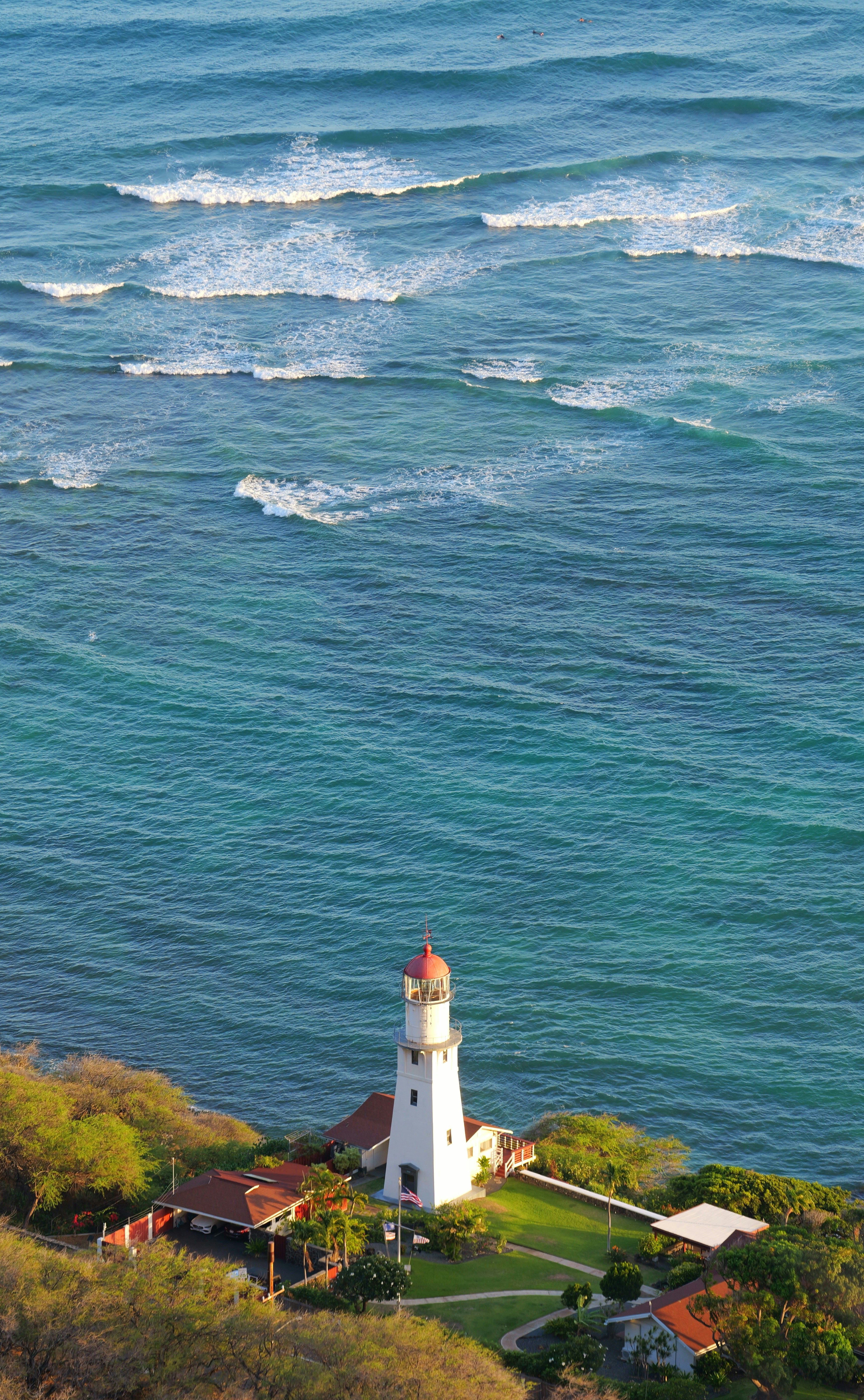 Coastal Beacon: A Seaside Lighthouse Nestled at the Shoreline