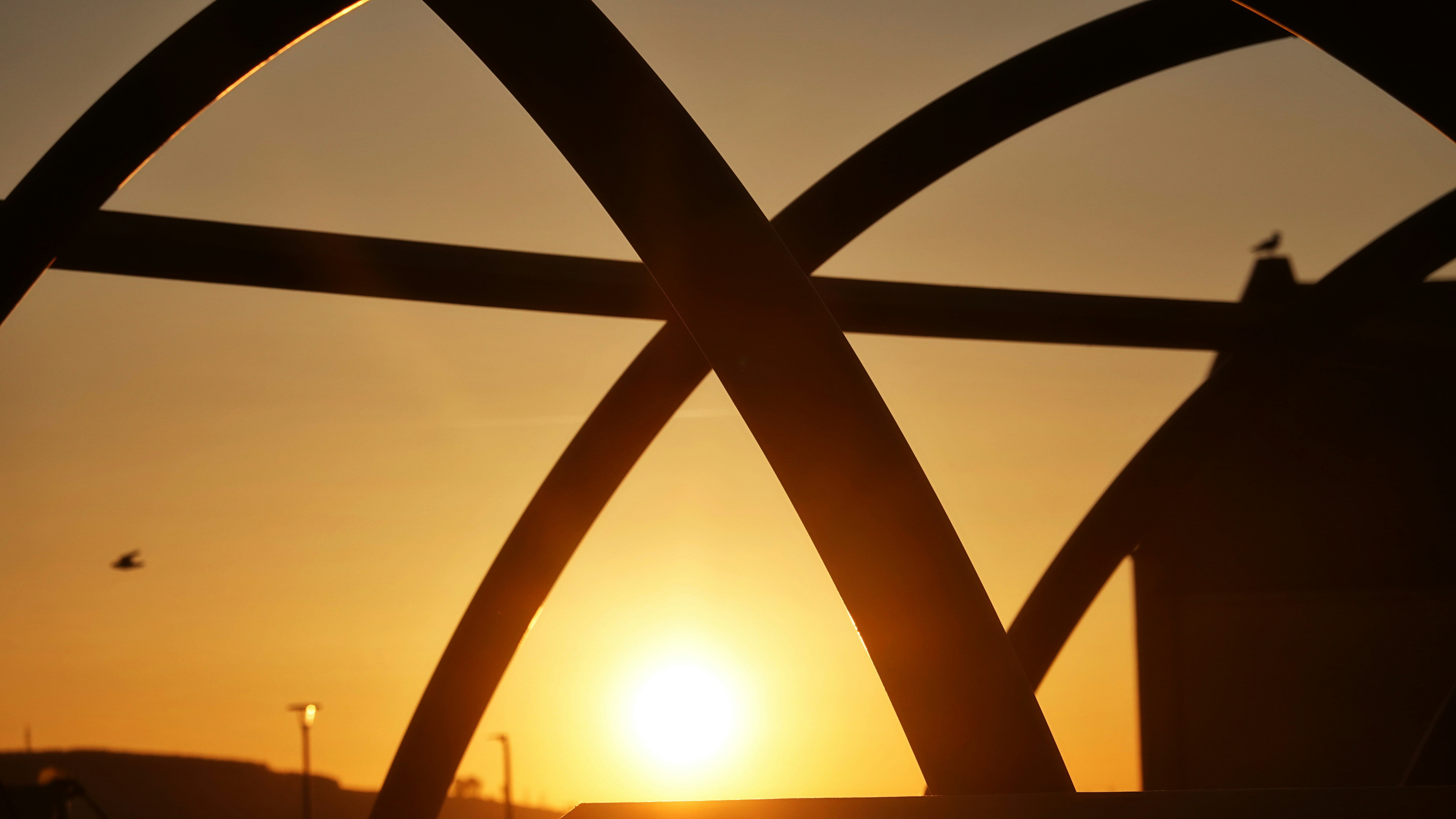 Sunset Overcrisscrossed Steel: A Silhouette at Dusk