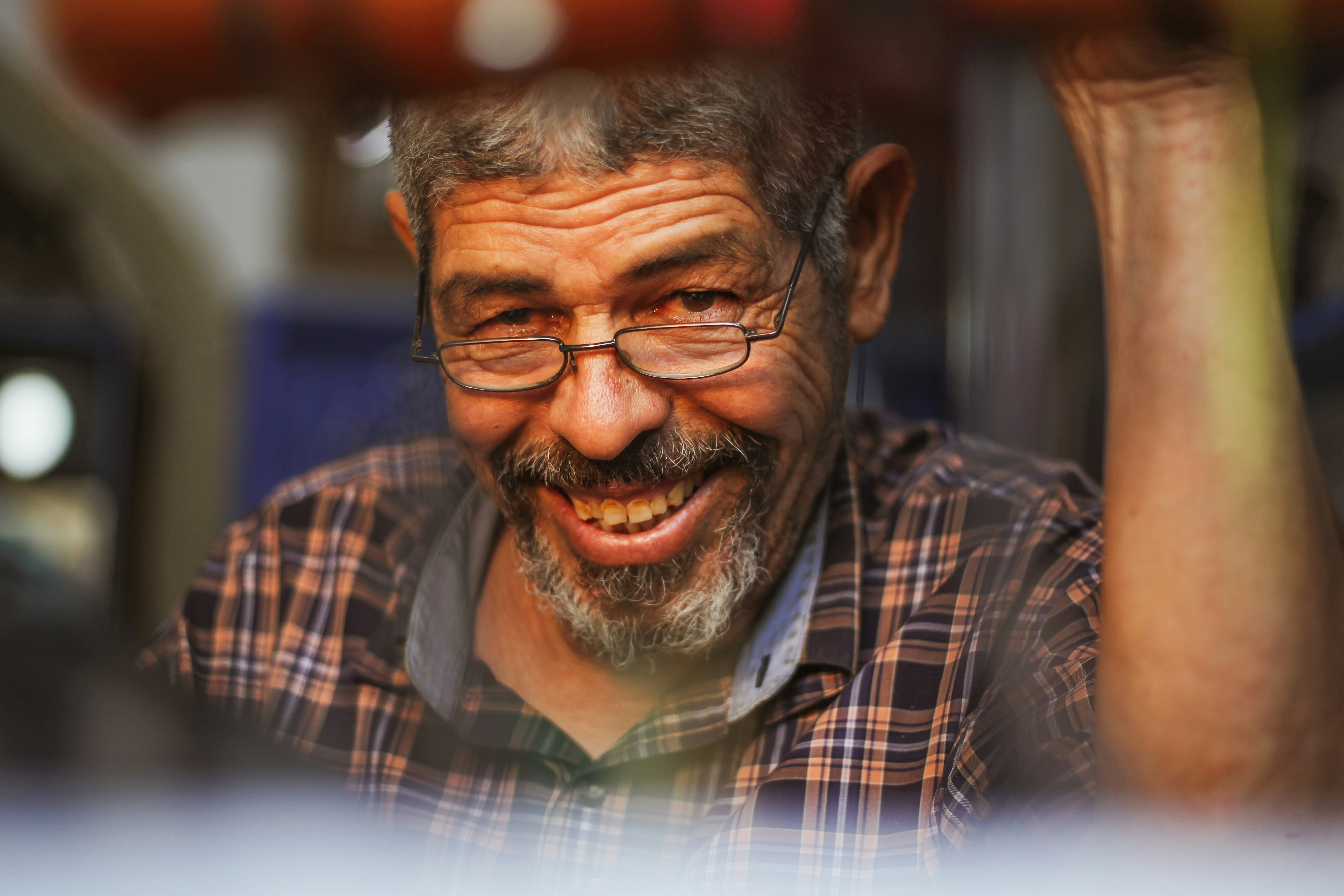 Smiling Artisan Through the Frame