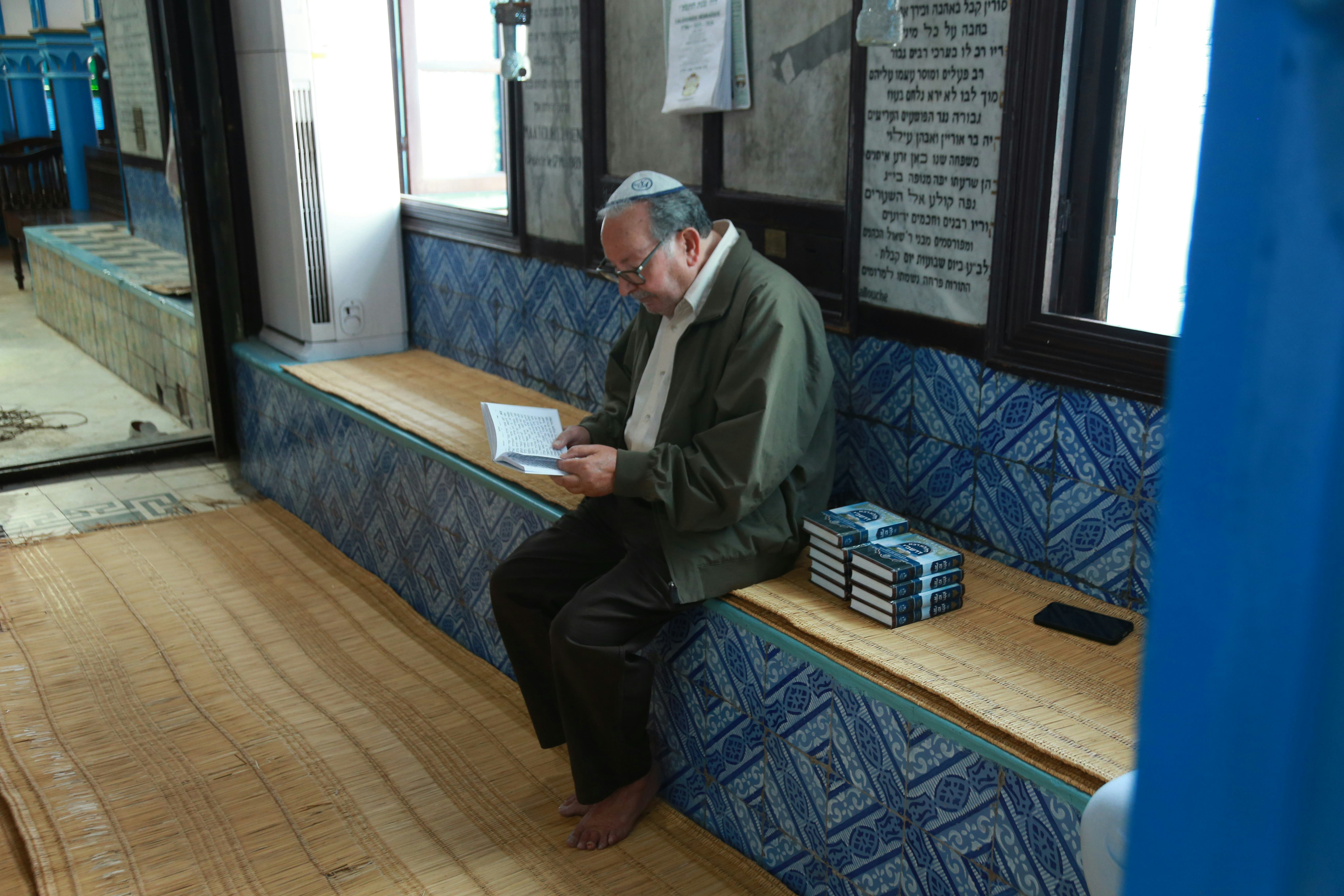 Reader in a Quiet Alcove: Focused Moment on an Elderly Scholar