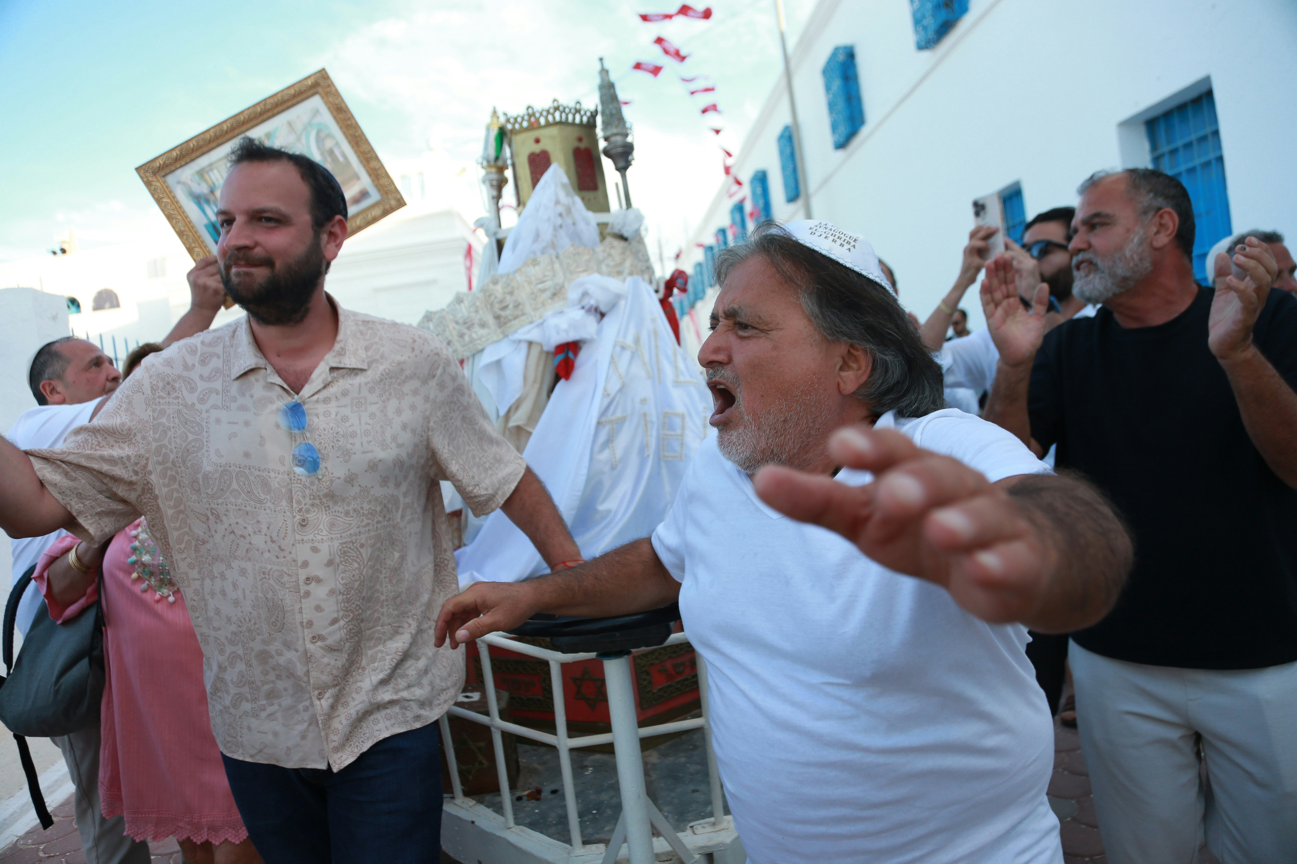 A Jubilant Procession Surges Through Whitewashed Tiles