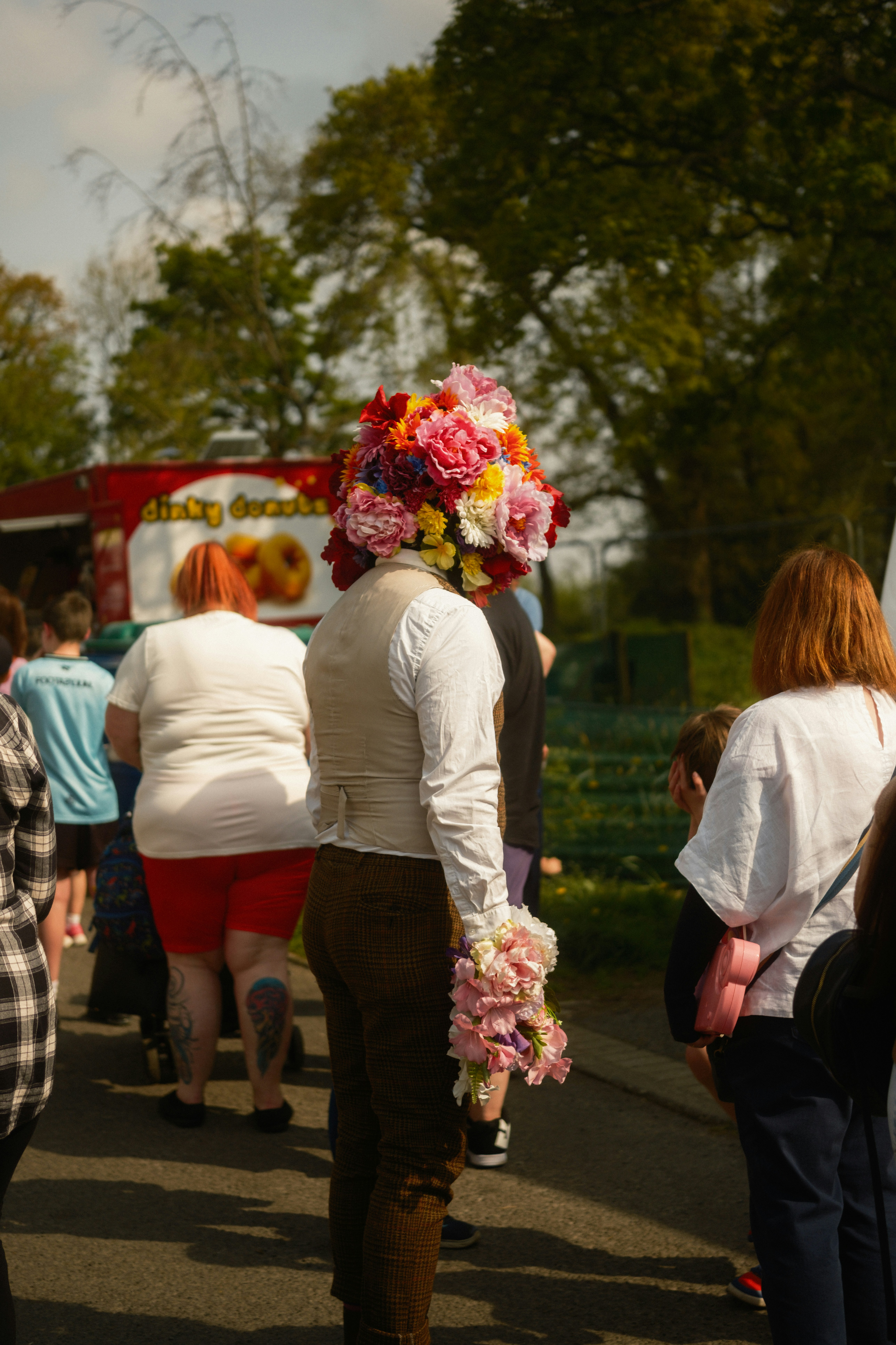 Floral Headdress in a Crowd at a Street Fair
