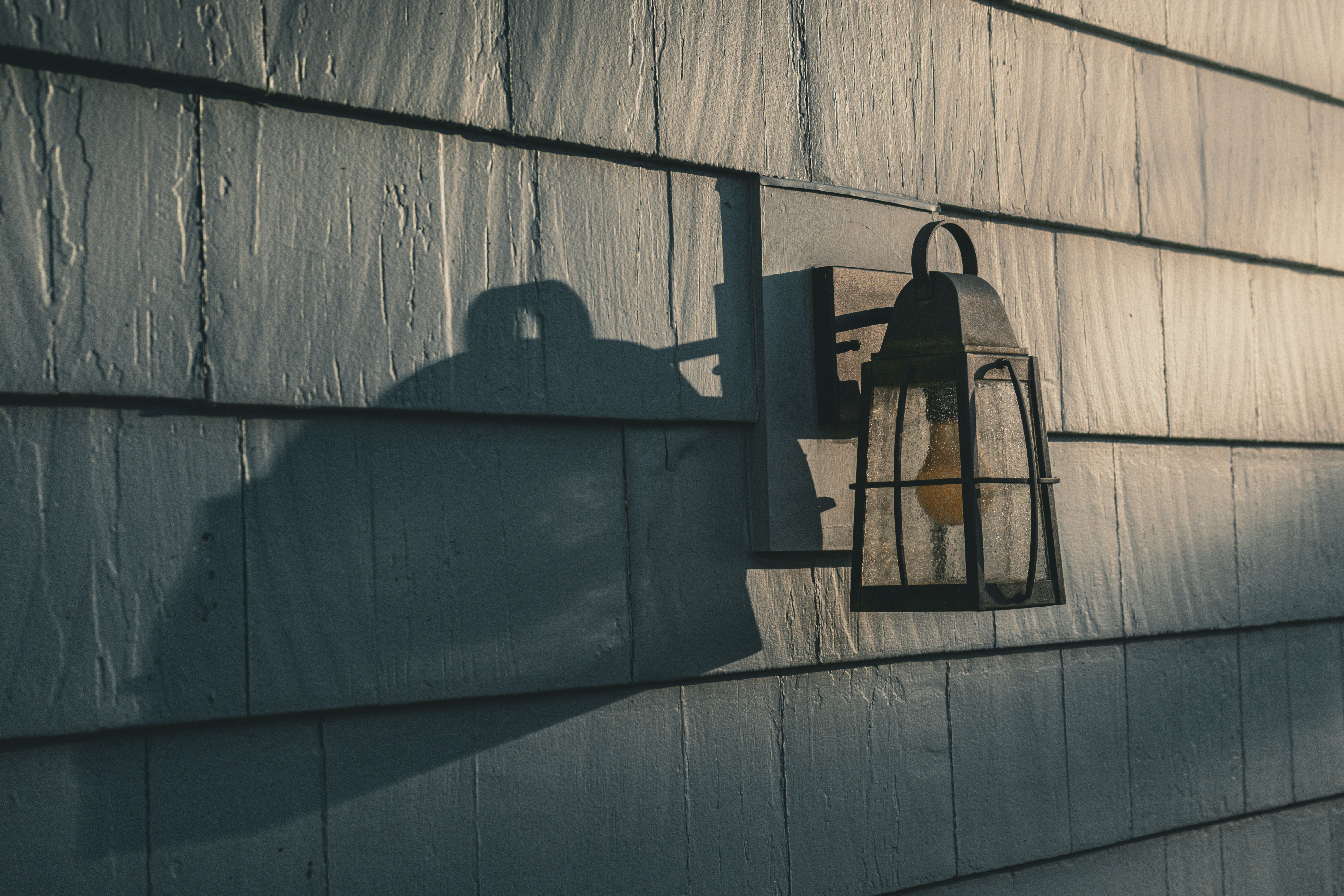 Luminous Lantern and Shadowed Siding