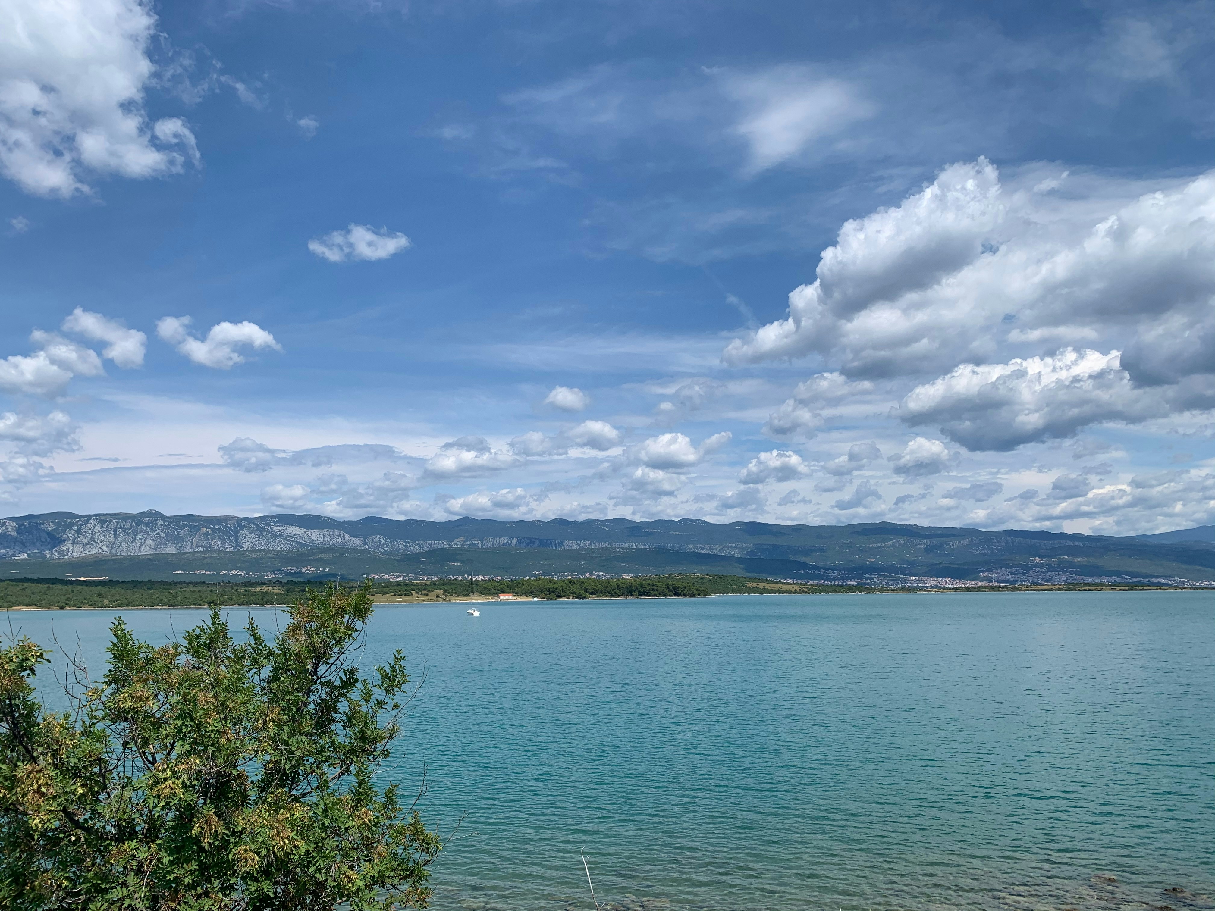 Azure Lake Under a Mottled Sky