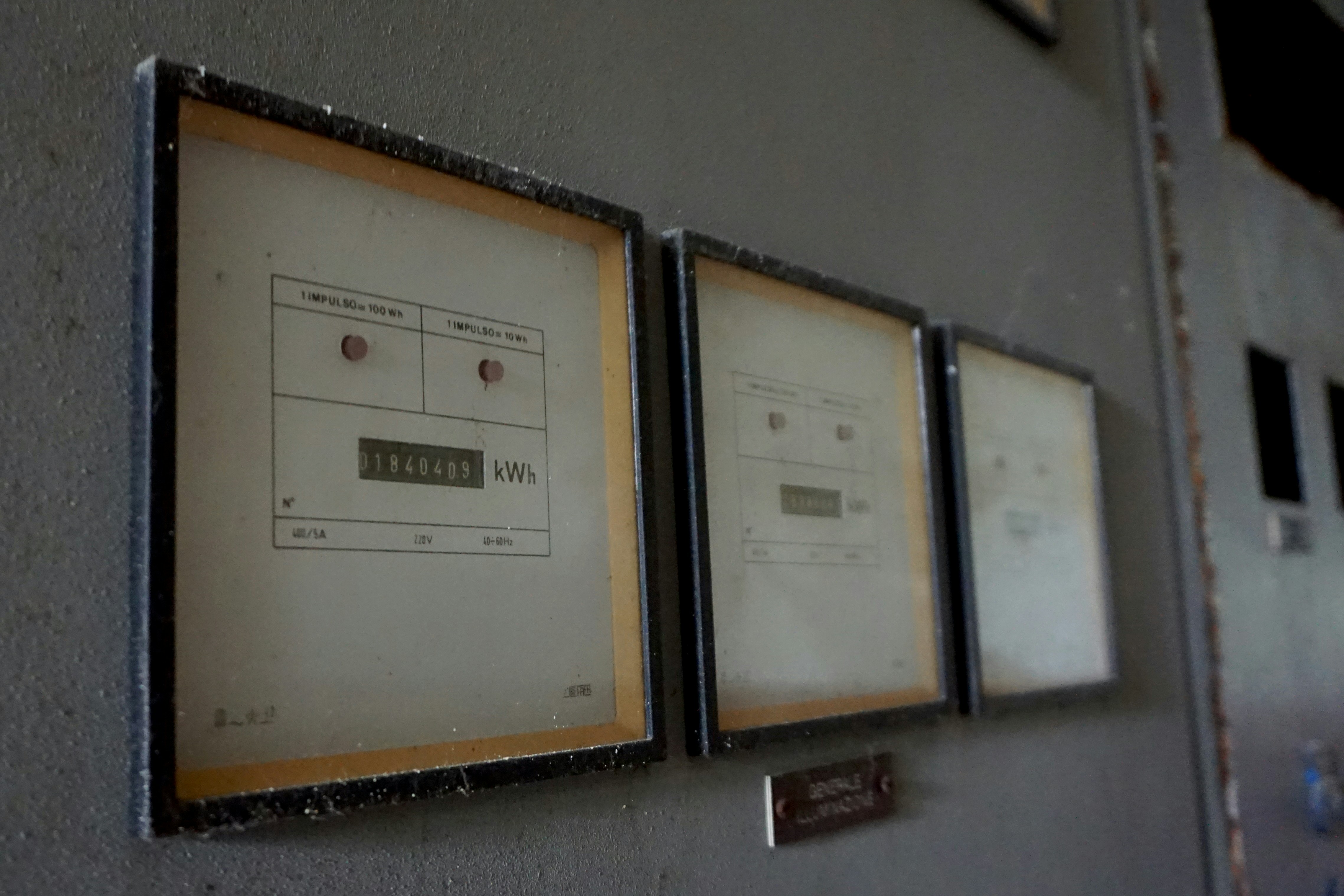 Dusty Utility Meters on a Weathered Wall