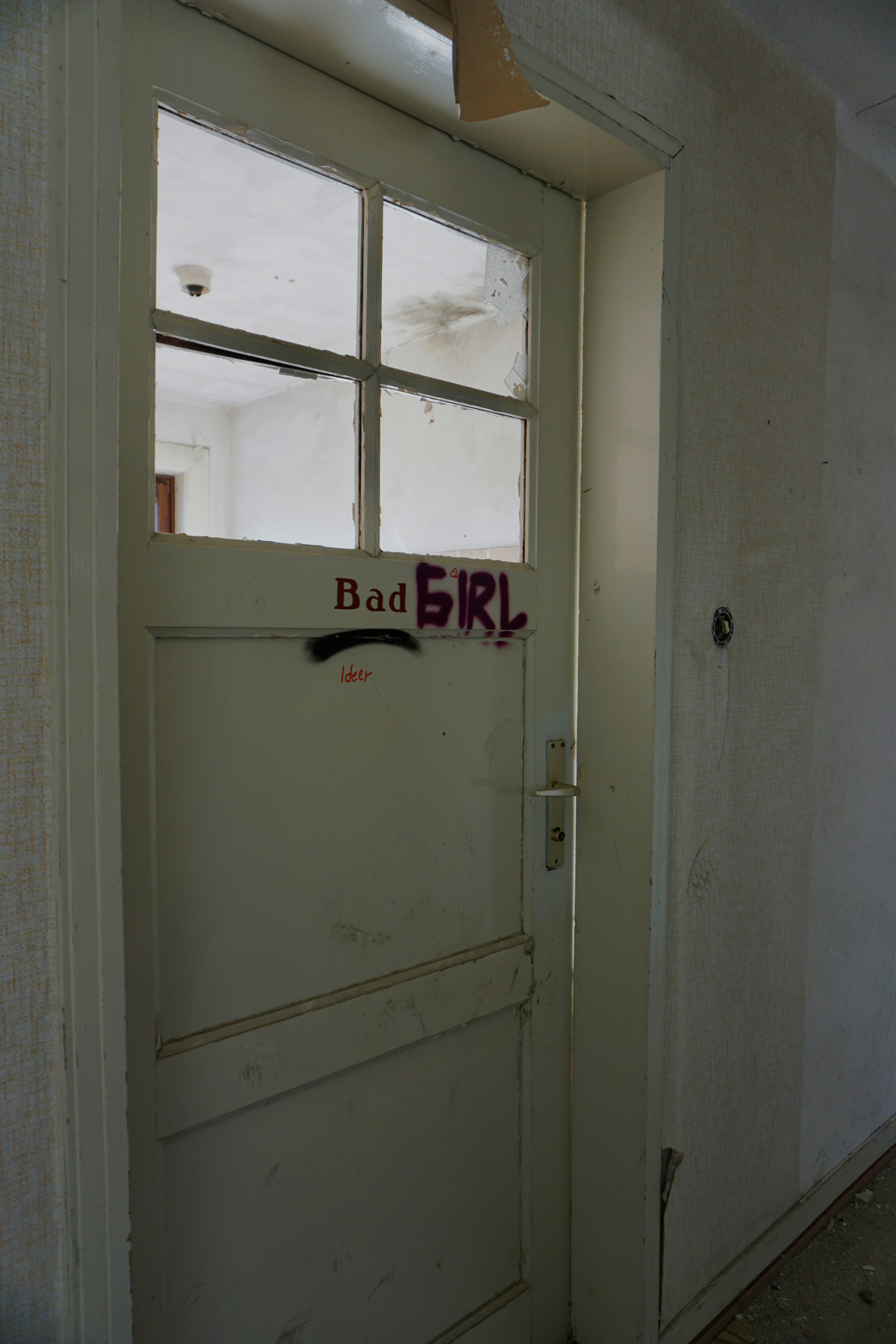 Doorway of Dissent: Bad Girl Graffiti in a Quiet Corridor