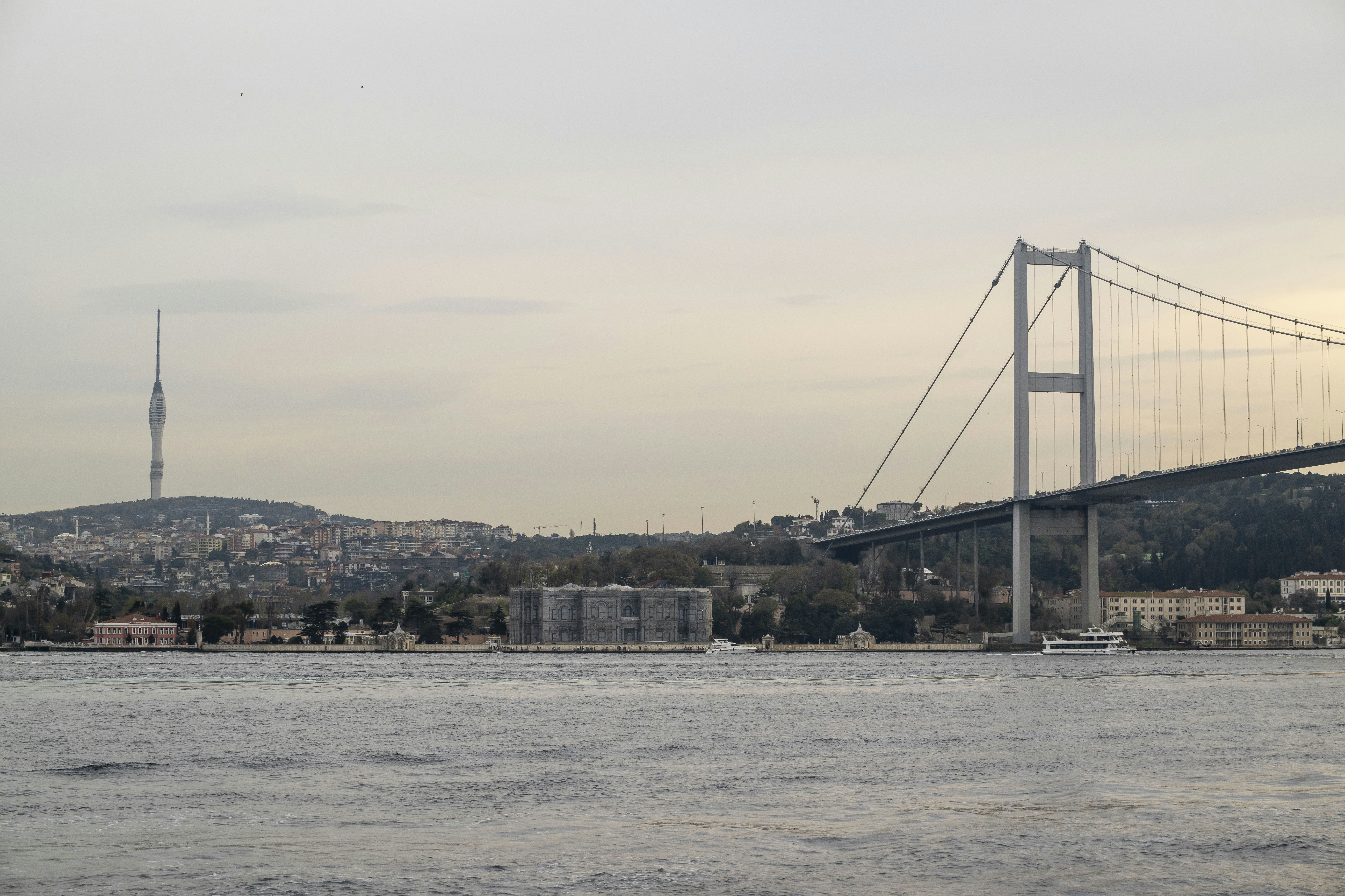 Bridge over Calm Waters: City Skyline Framed by a Silent Span