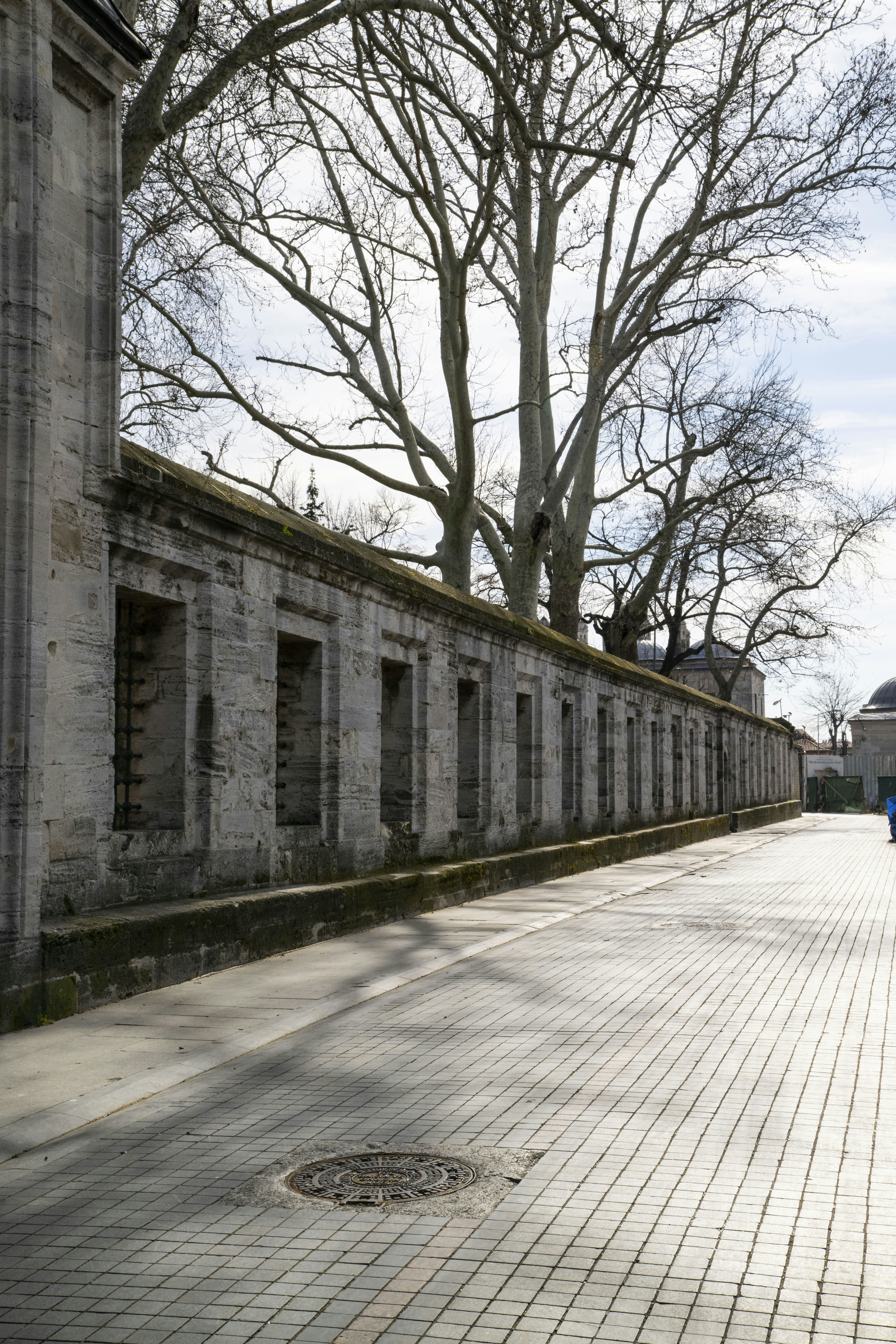Stone Corridor: A Quiet Run of Windows and Shadowed Light