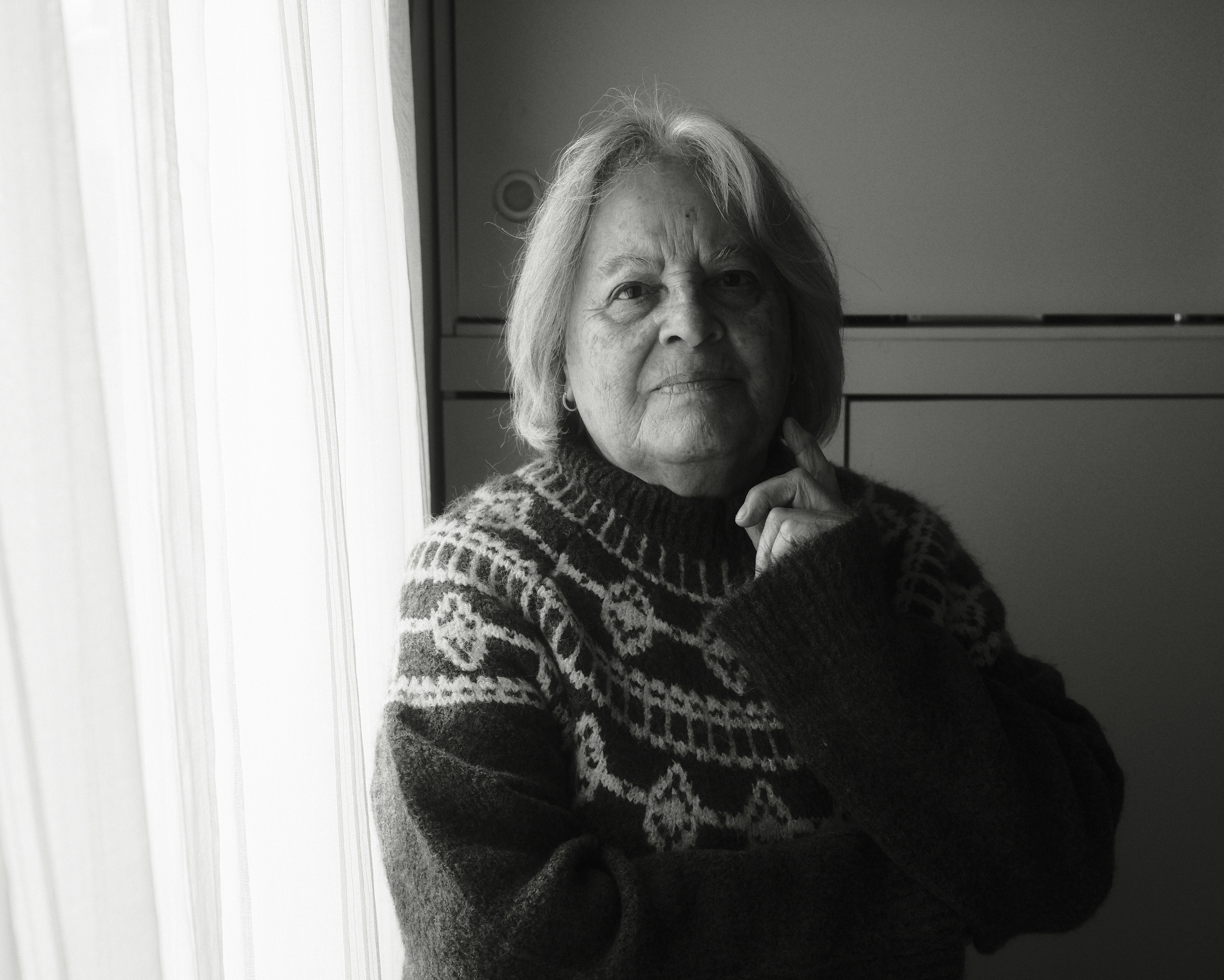 Quiet Resolve: Elder Portrait in Window Light