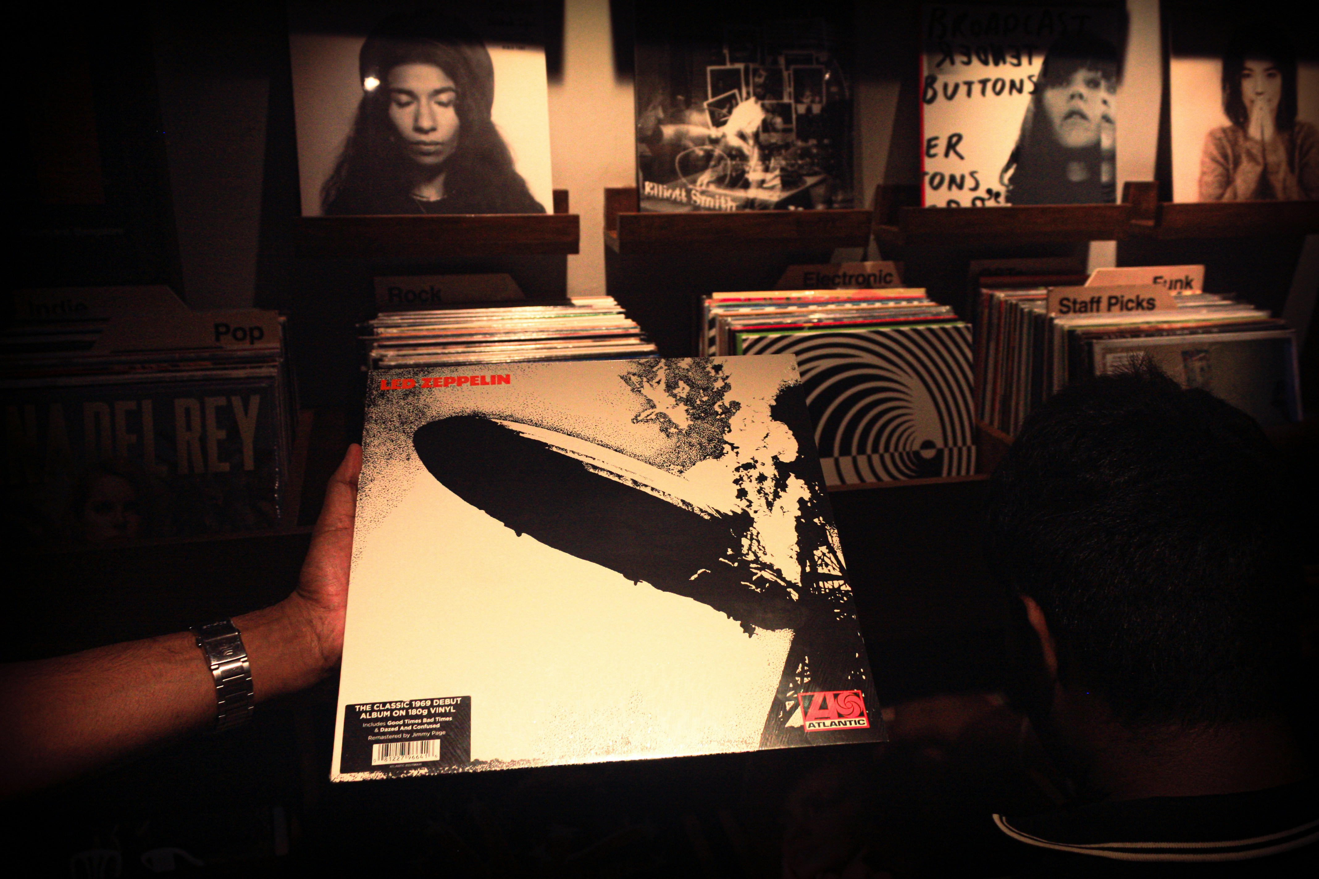 Vinyl in Focus: A Record Store Moment Shrouded in Warm Light