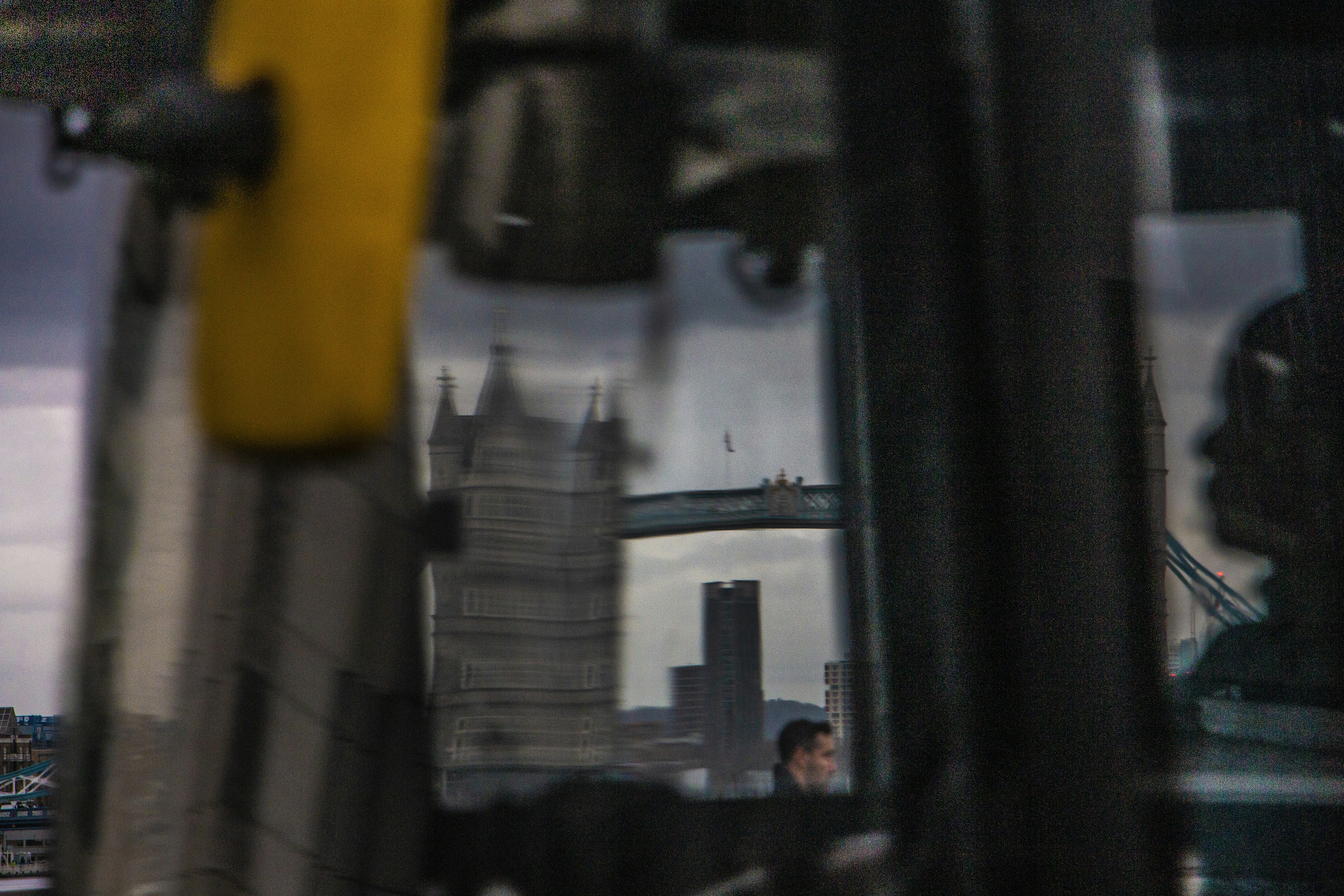 Through the Glass Frame: City Silhouettes and a Lone Worker