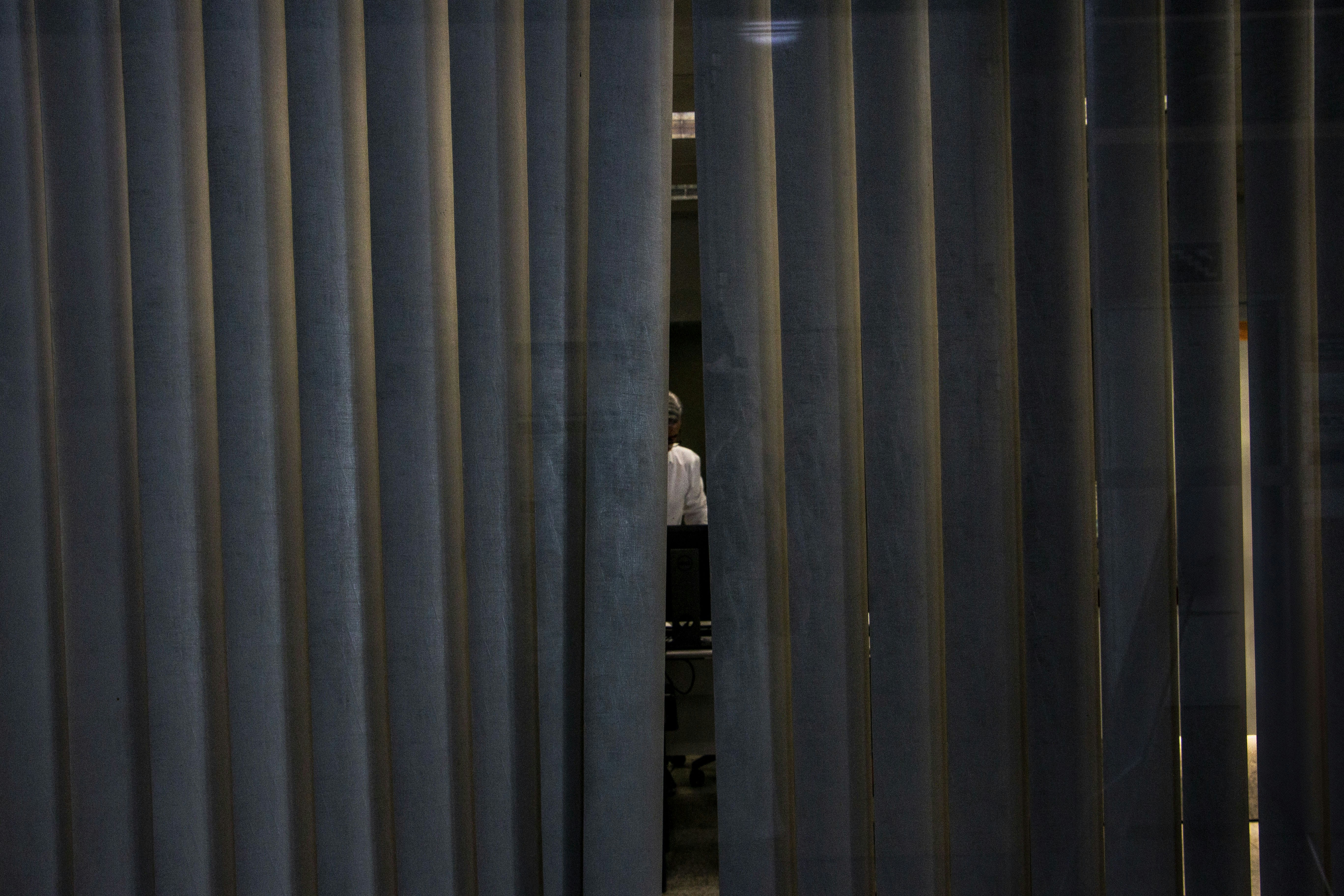 Through the Slats: A Quiet Break in the Curtain