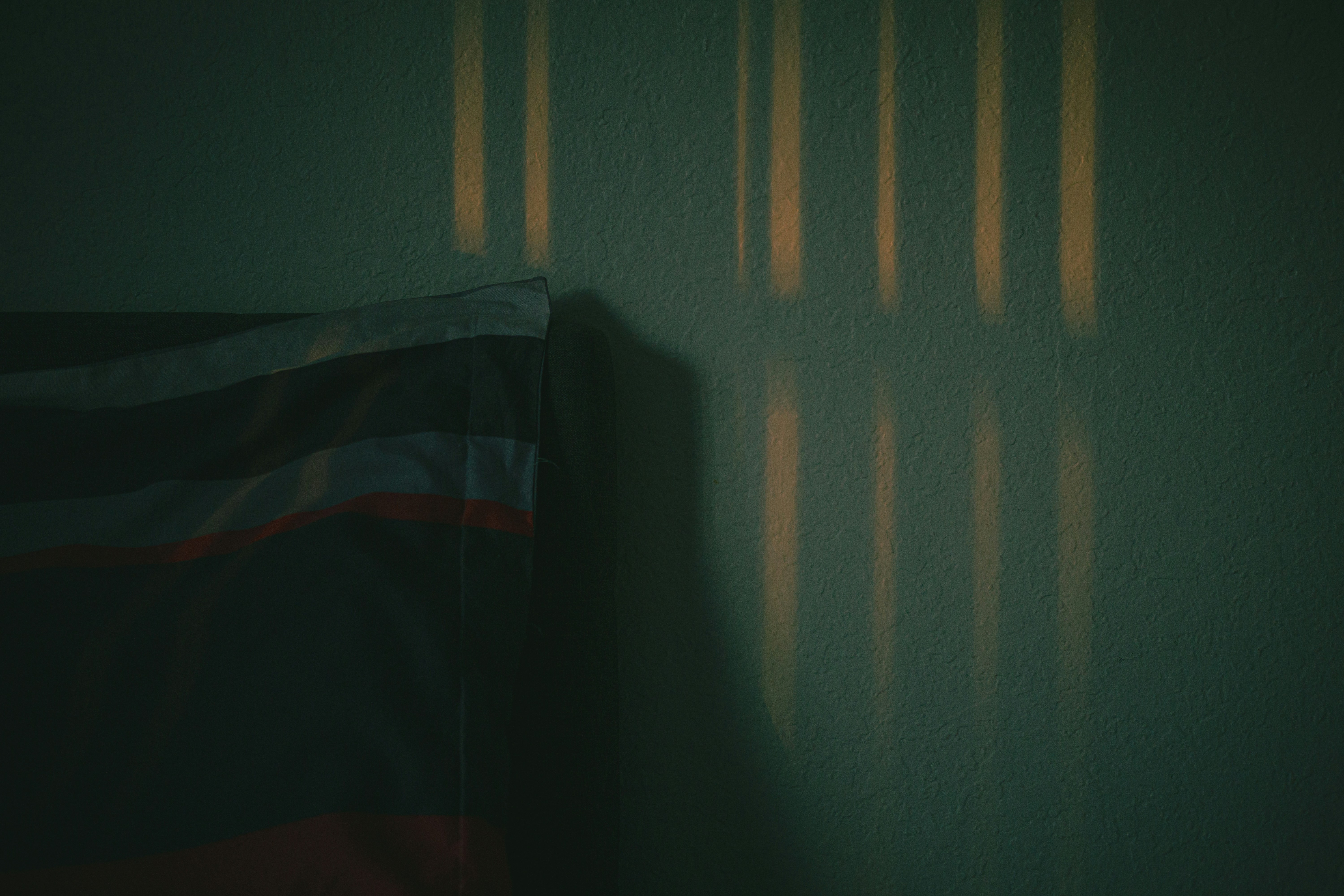 Shadowed stripes on a quiet wall