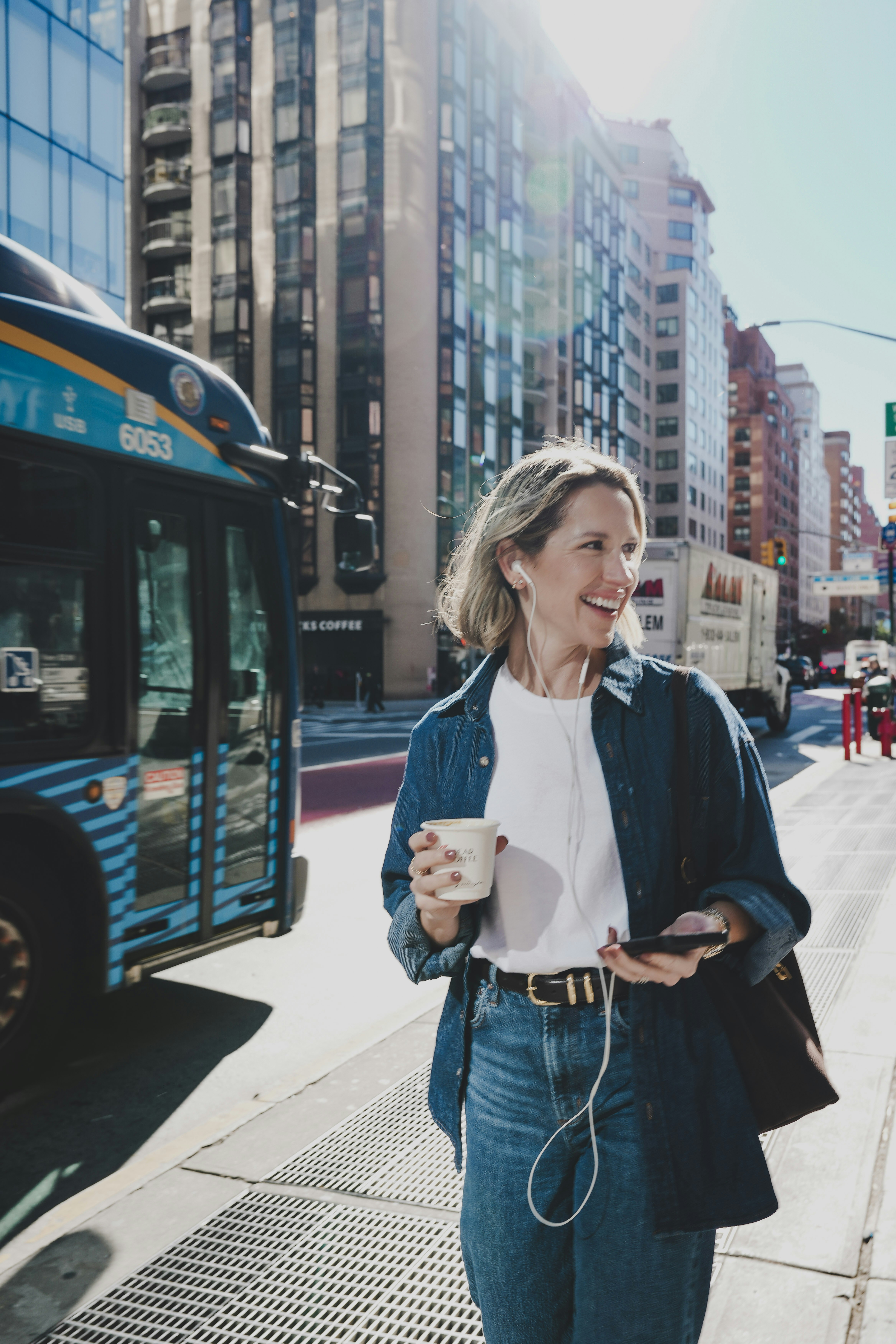 City Street Moment: Coffee, Cables, and a Smile