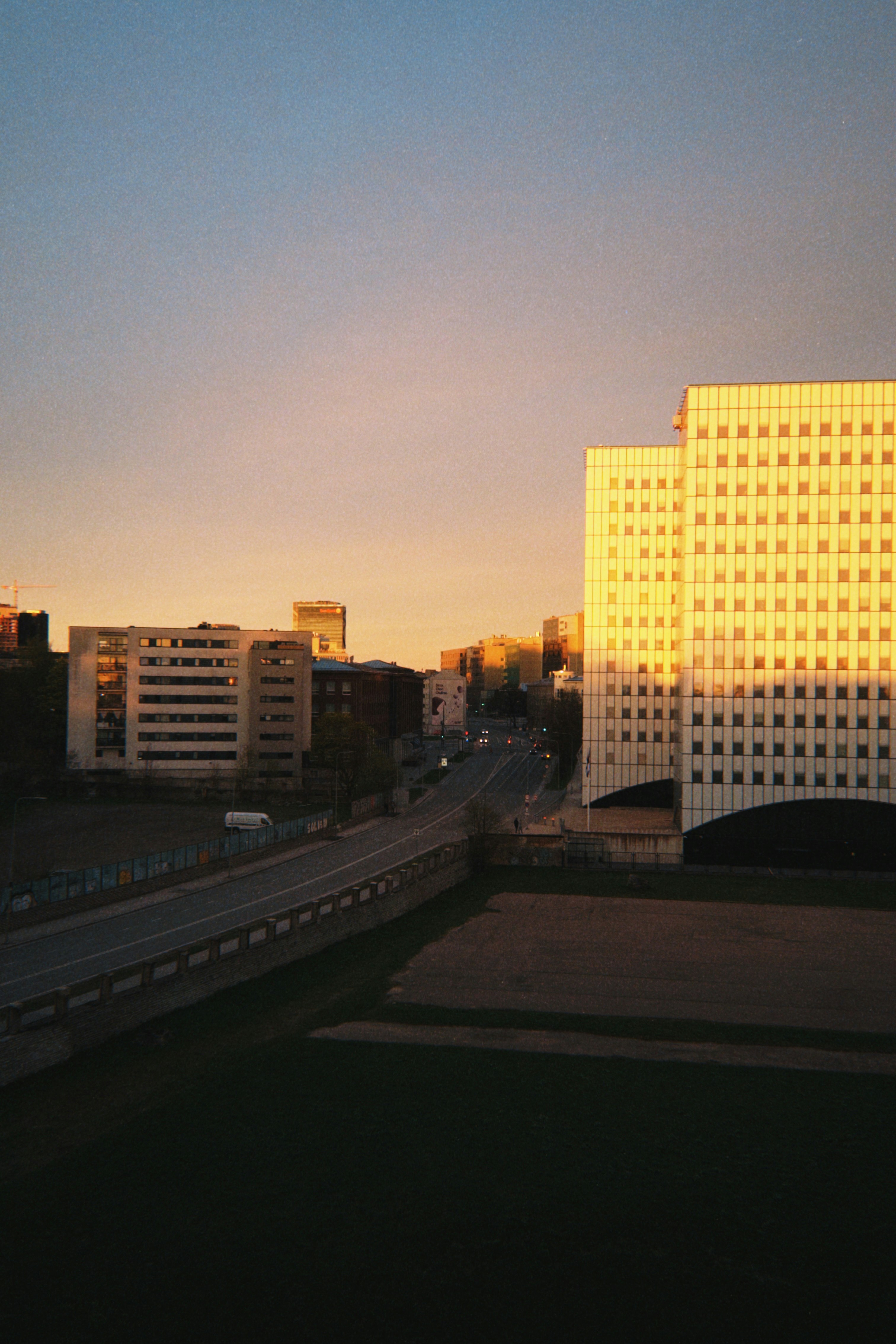 Golden Facade at Sunset Over Quiet Urban Spine