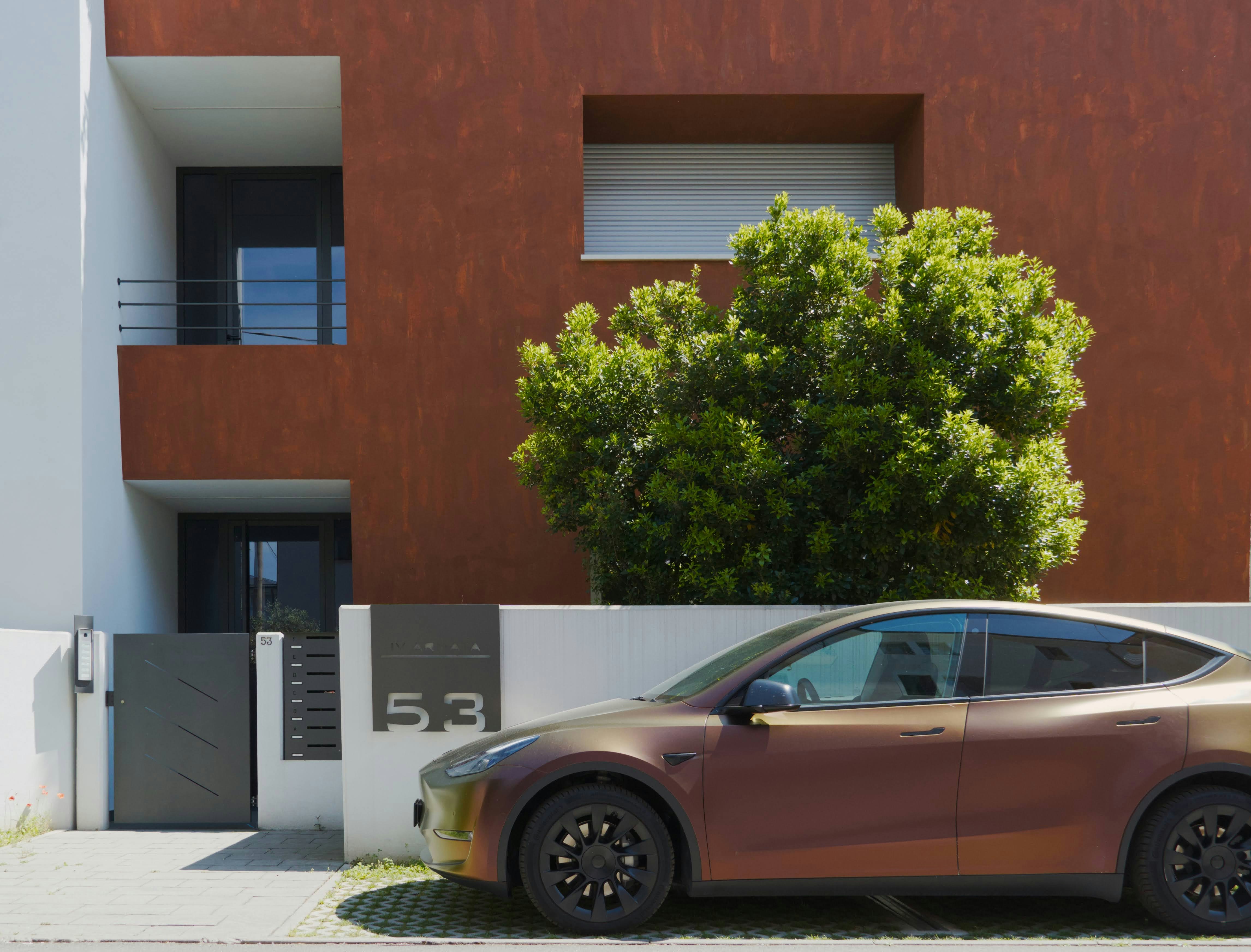 Bronze Tesla in Front of Modern Nest