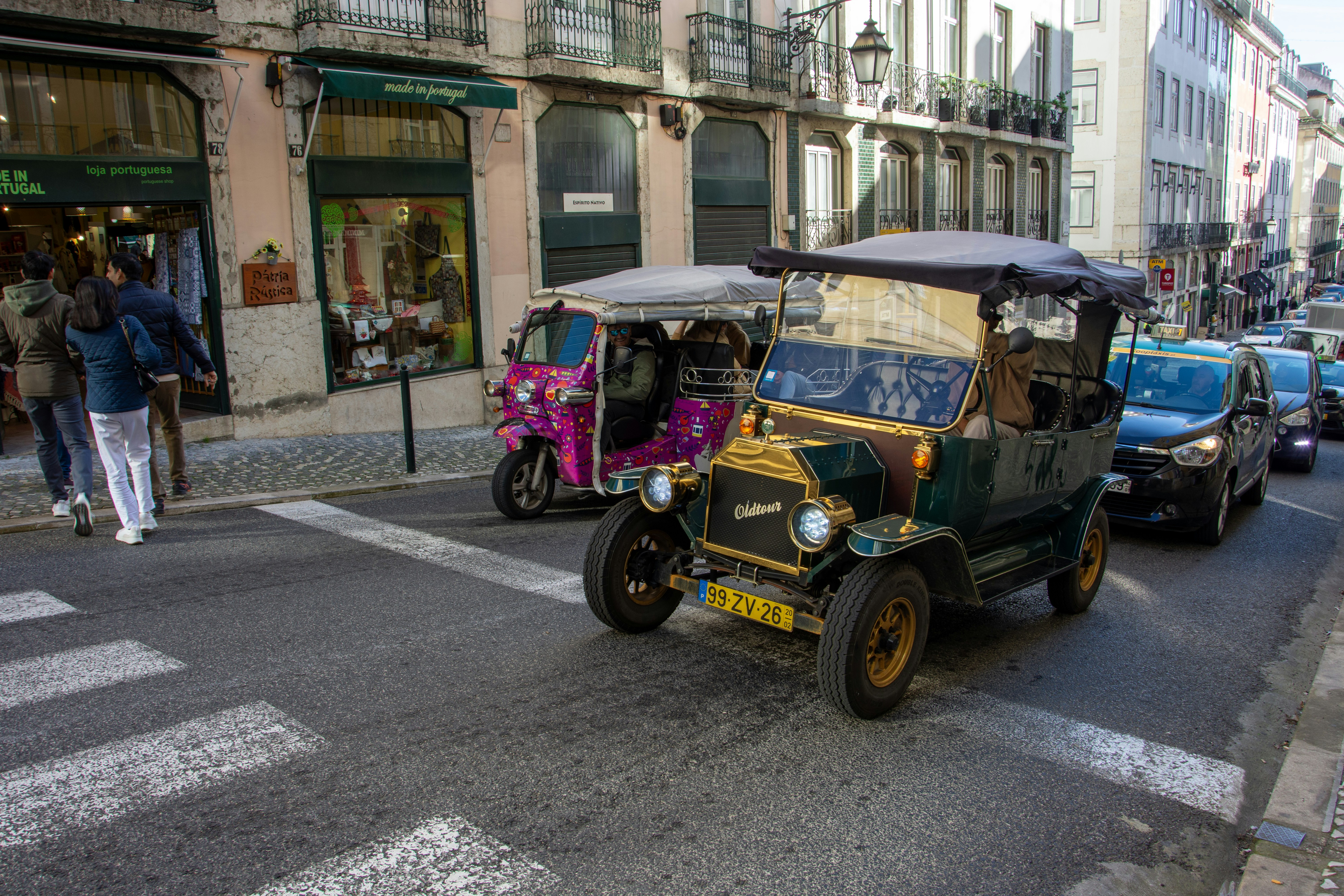 Vintage Car Parade on a Cobblestone Street