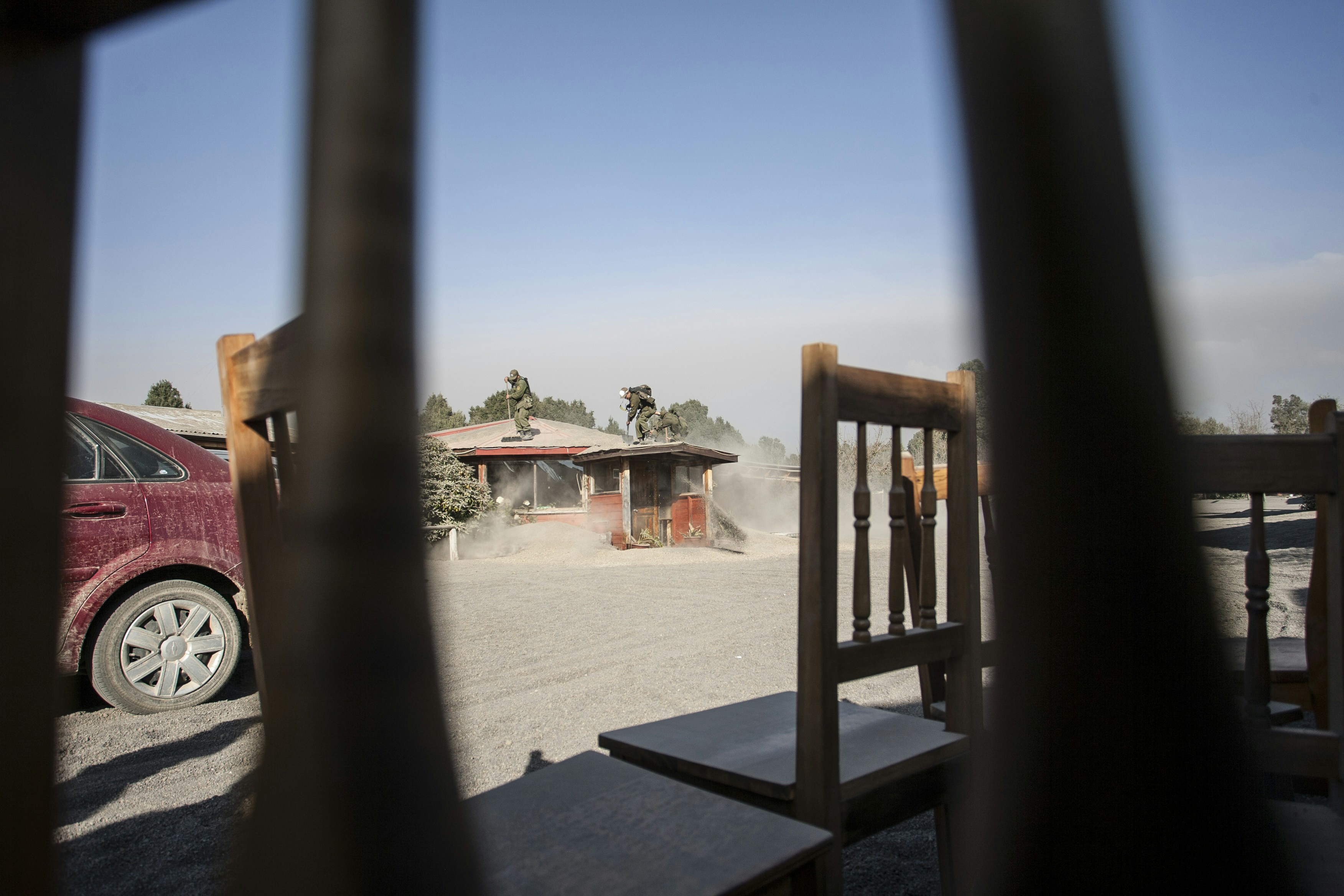 Dusty courtyard glimpse through weathered slats