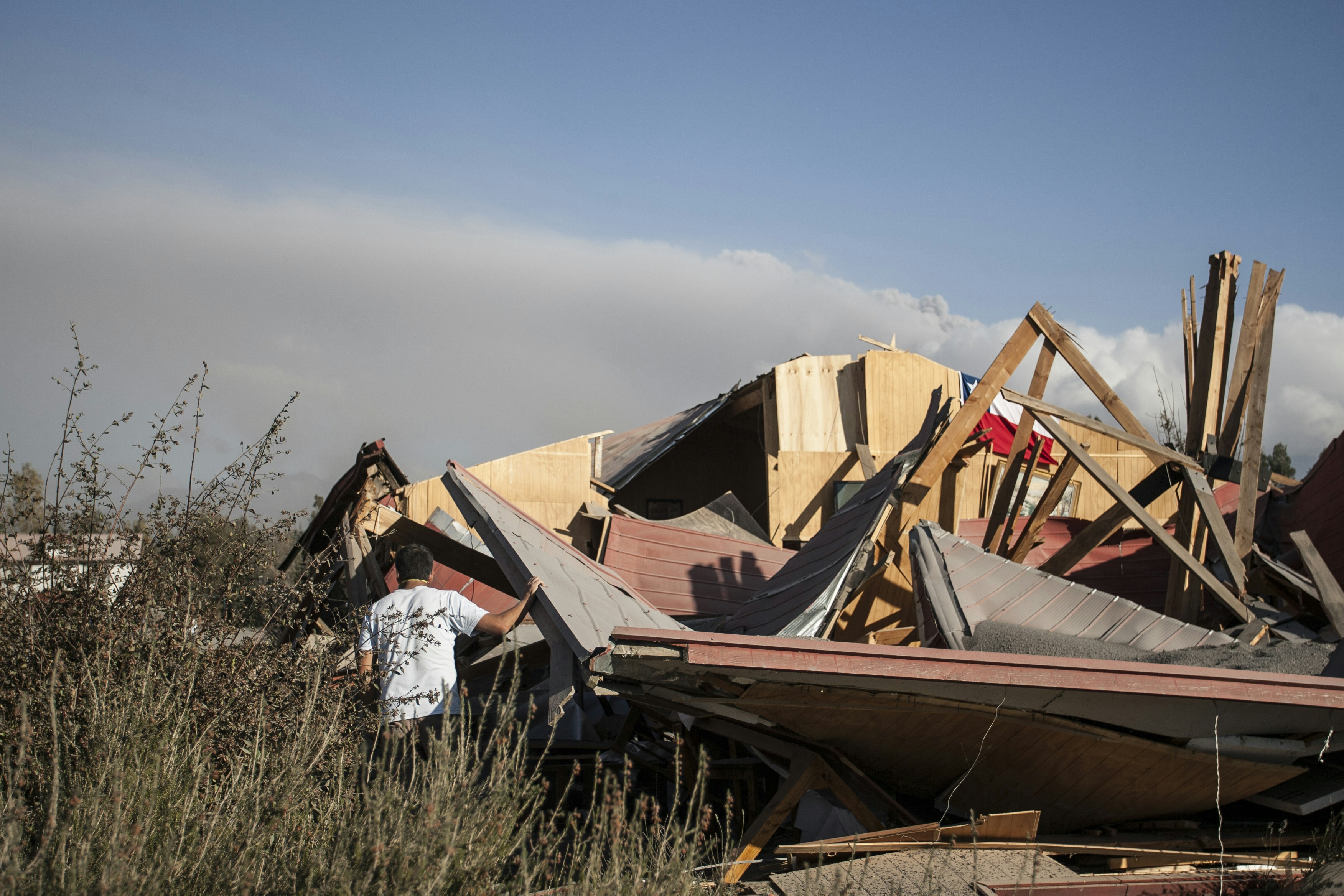 Collapsed Workshop Echoes: A Lone Figure Among Debris