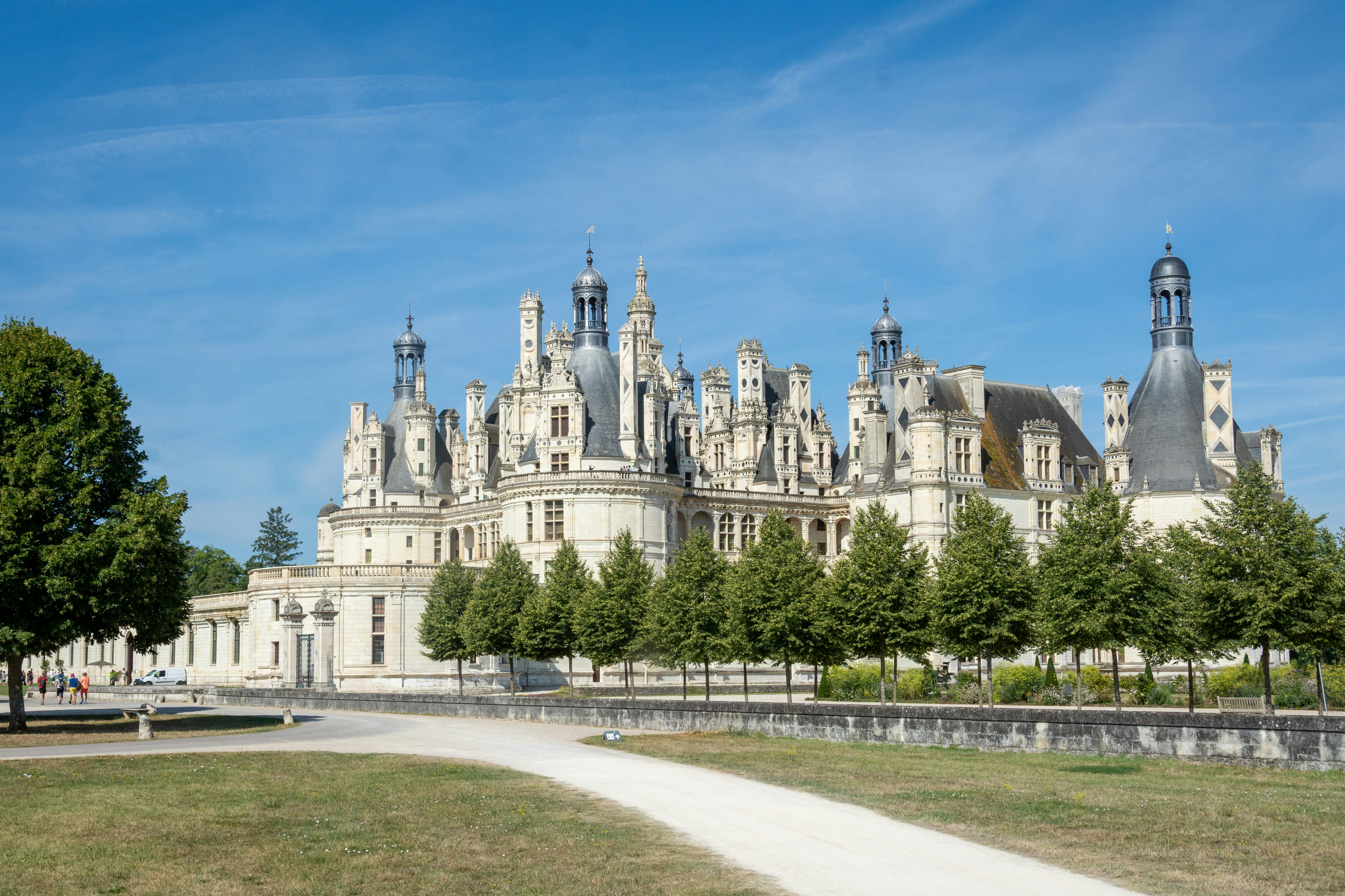 Majestic Château Silhouettes Under a Blue Skies