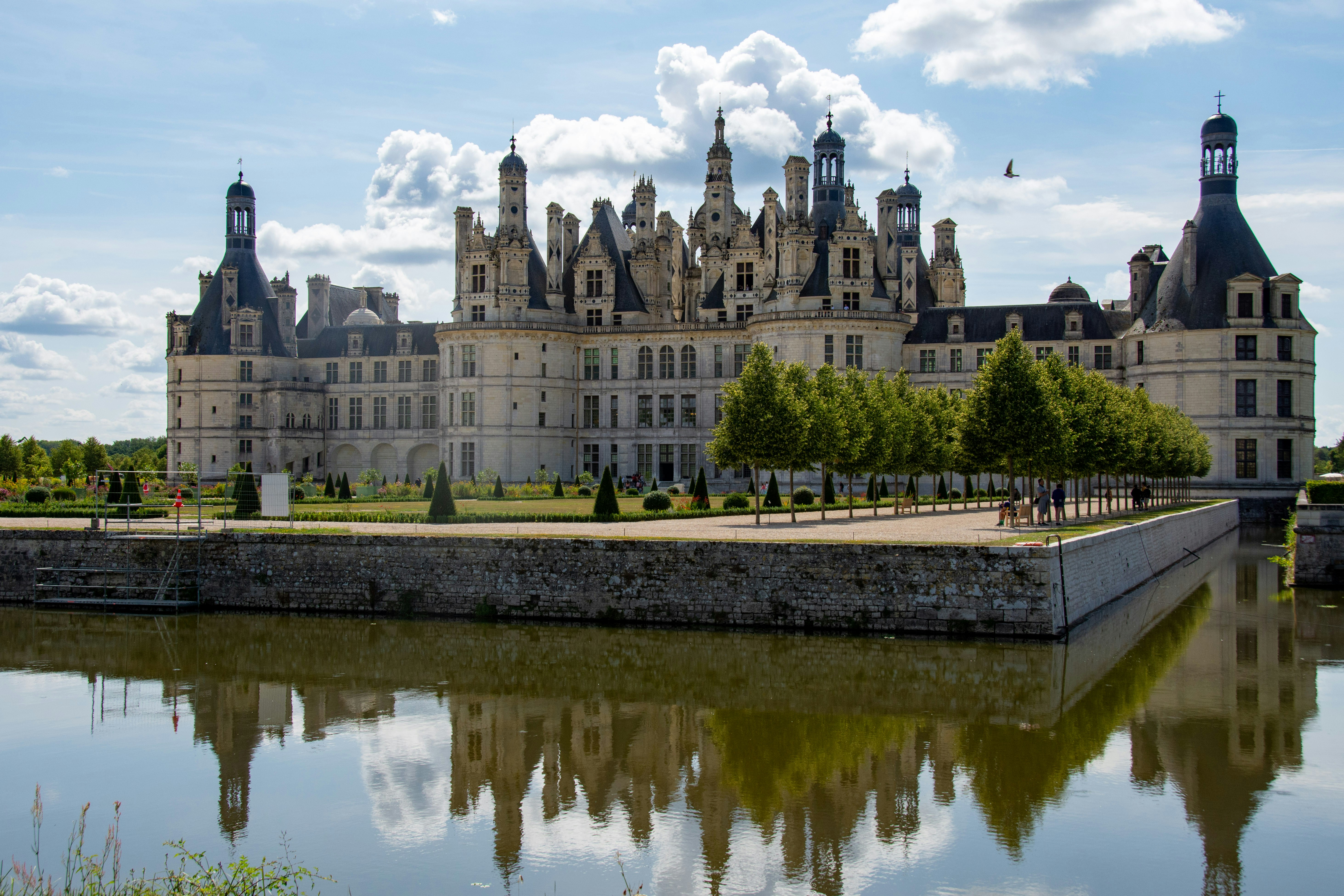 Foam and Facades: The Château Surrounded by Reflective Moat