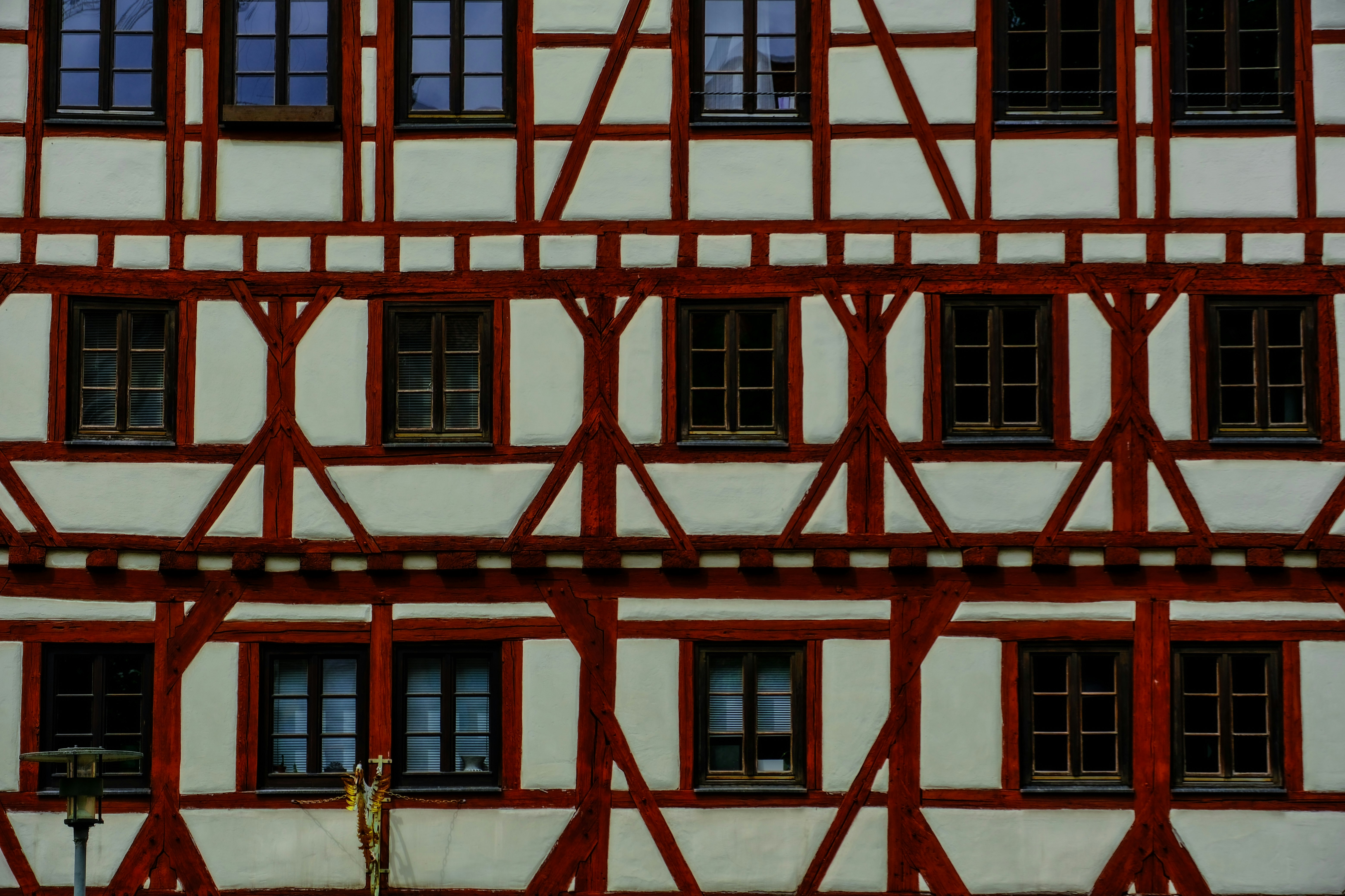 Traditional timber-framed building facade with many windows