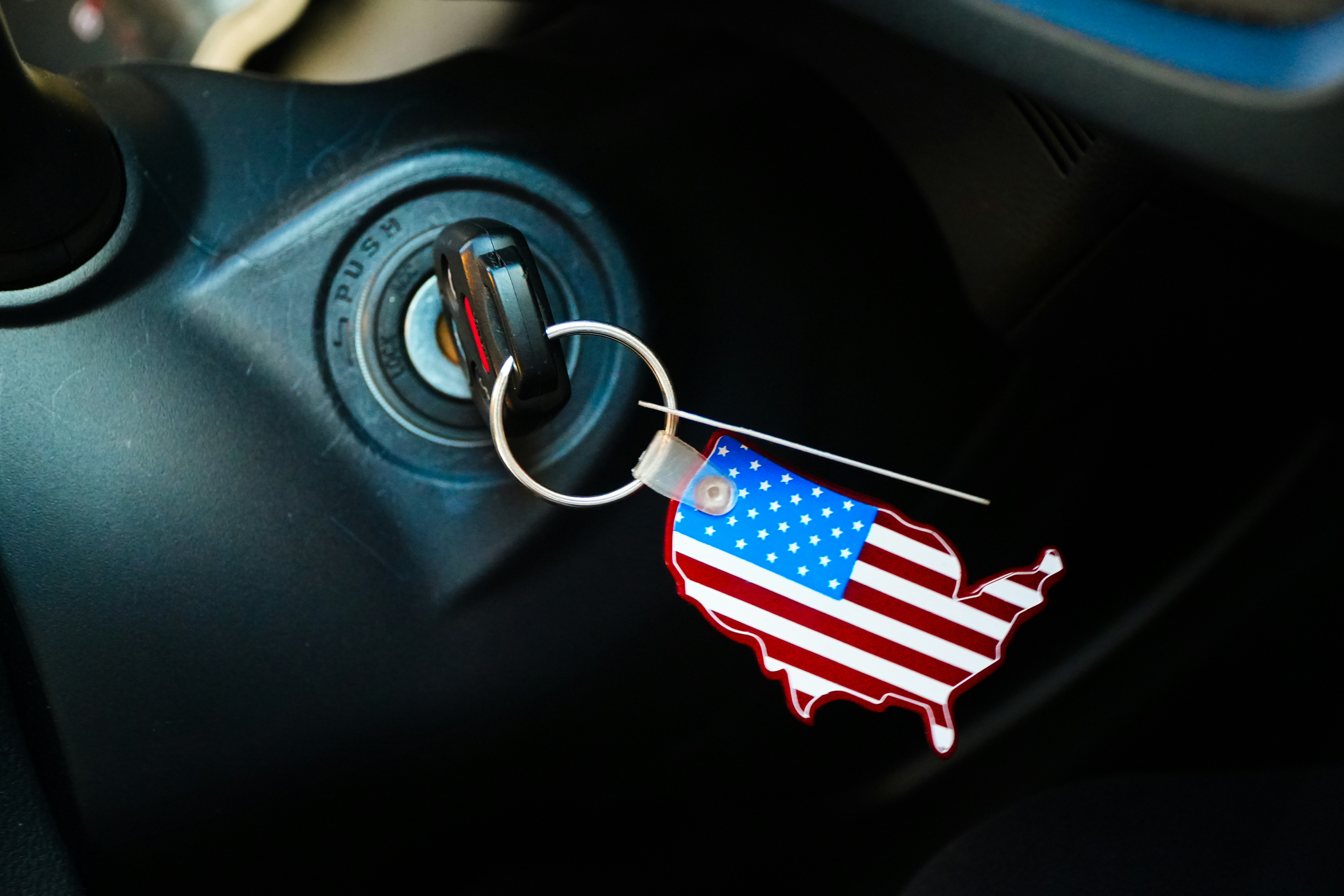 Key to Freedom: American Flag Keychain Dangles from Car Ignition