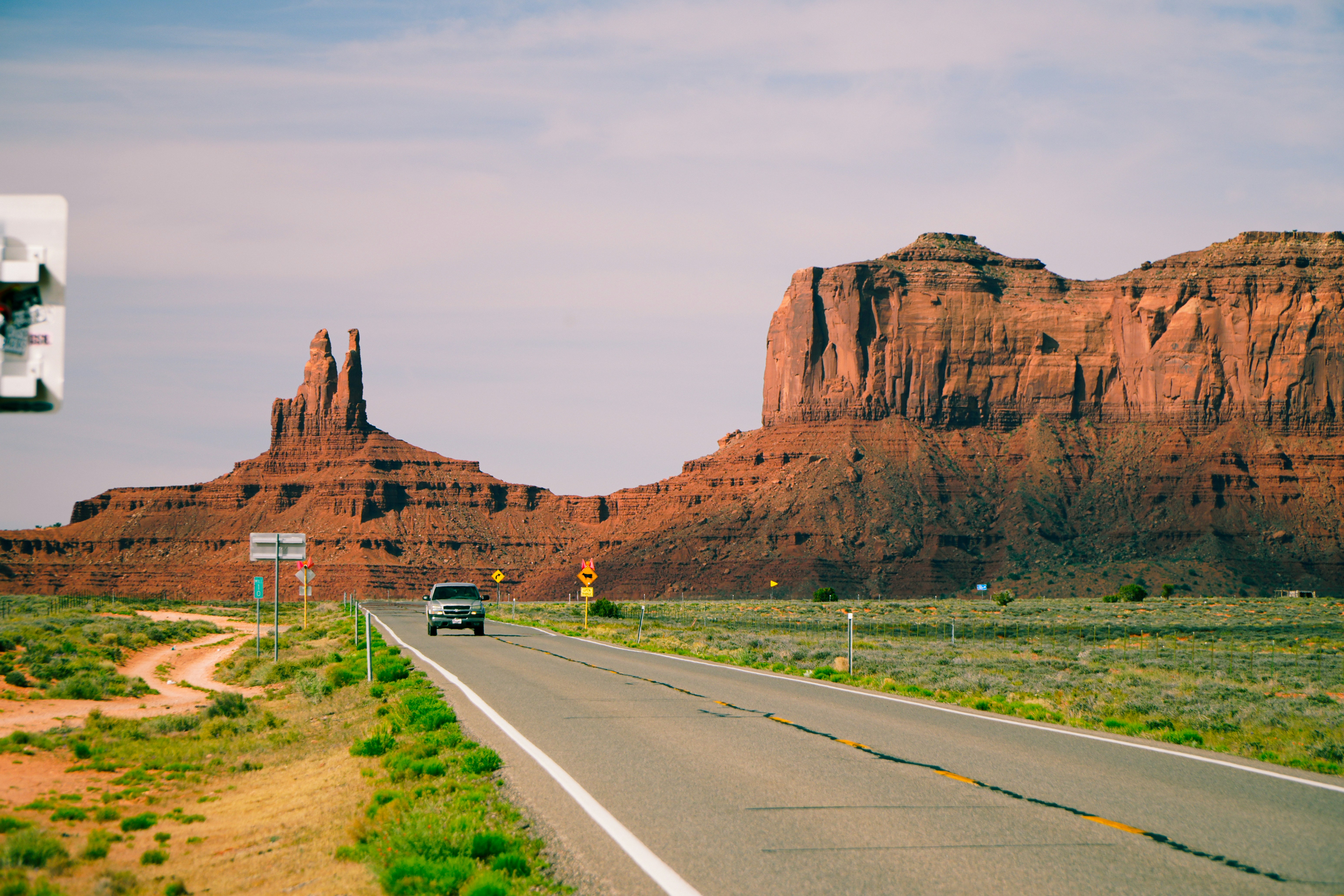 Desert Highway Beneath Monumental Sky