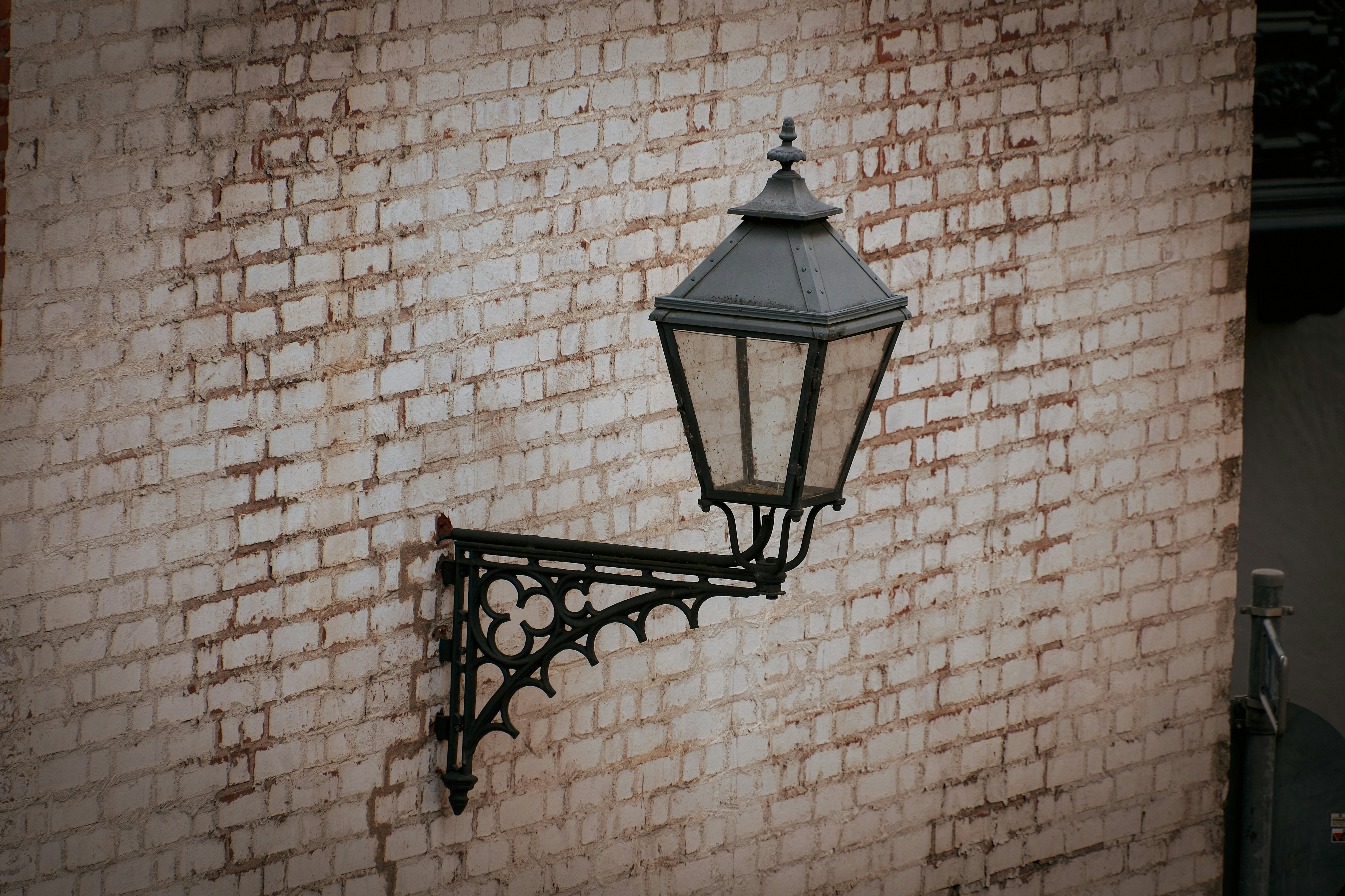 Lantern on a Bricked Wall: A Quiet Corner of Light and Iron