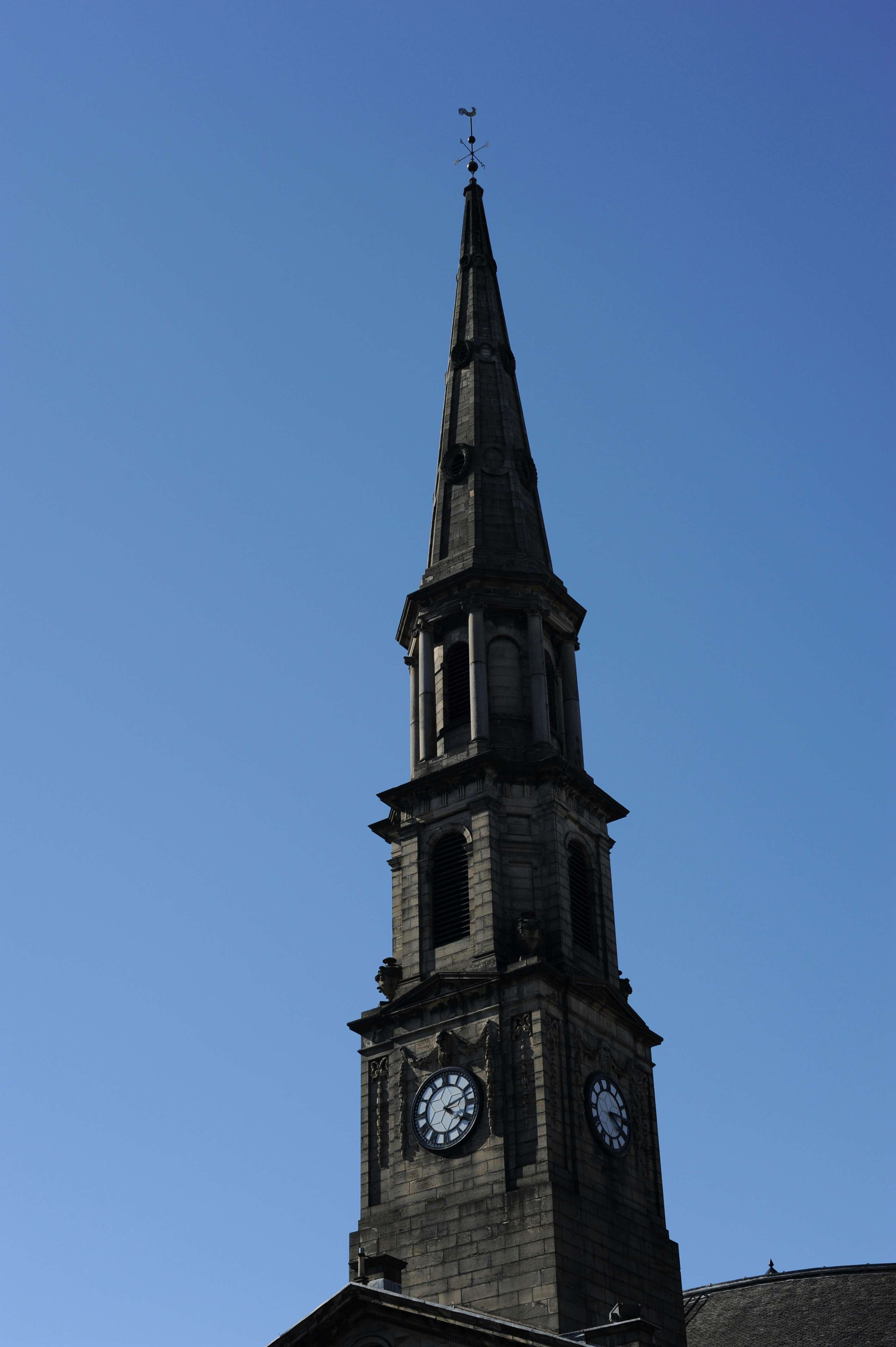Spire Against the Sky: A Clocktower Reaches Toward the Blue