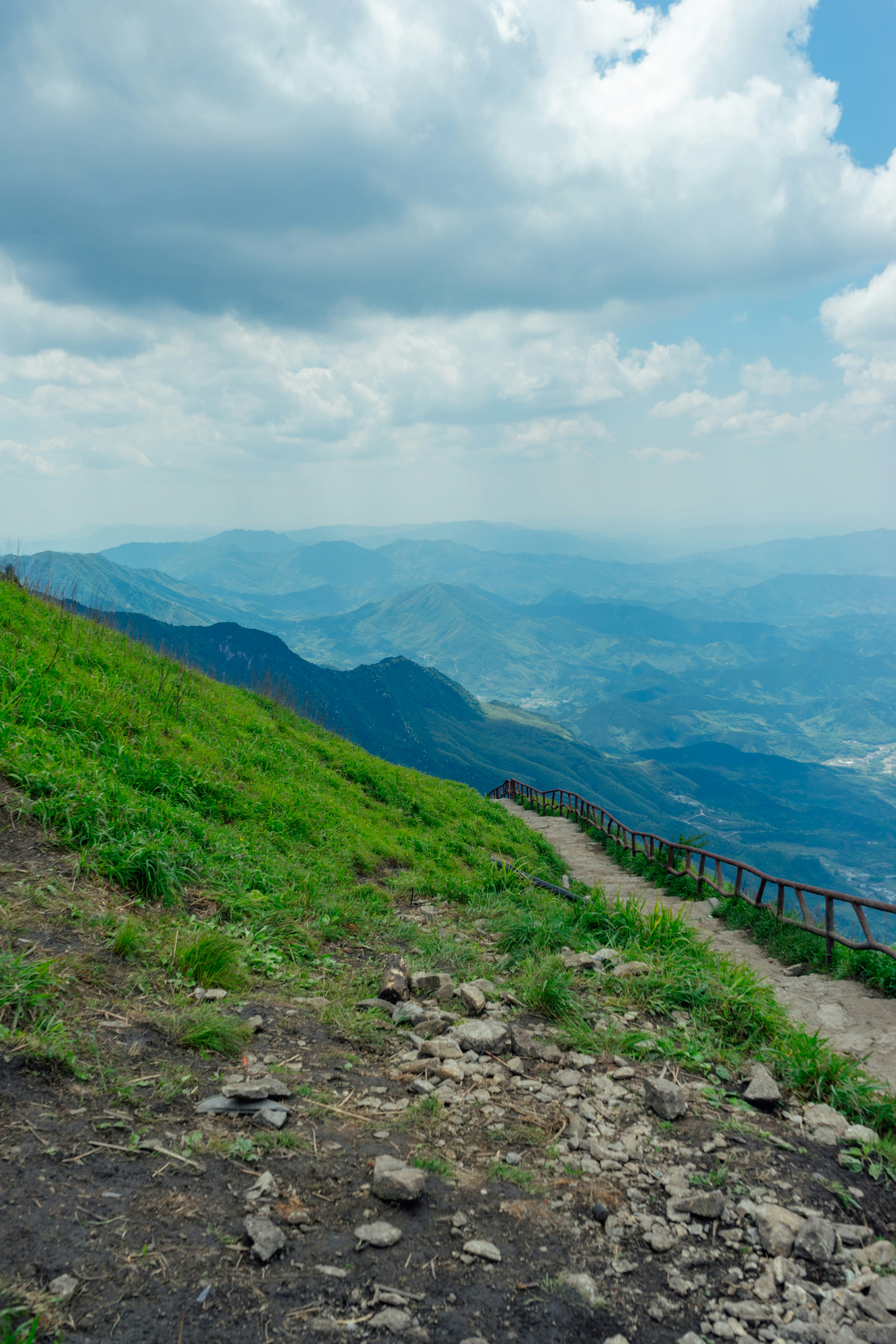 Path to the Rim: A Verdant Trail Wrapping a Mountain Vista
