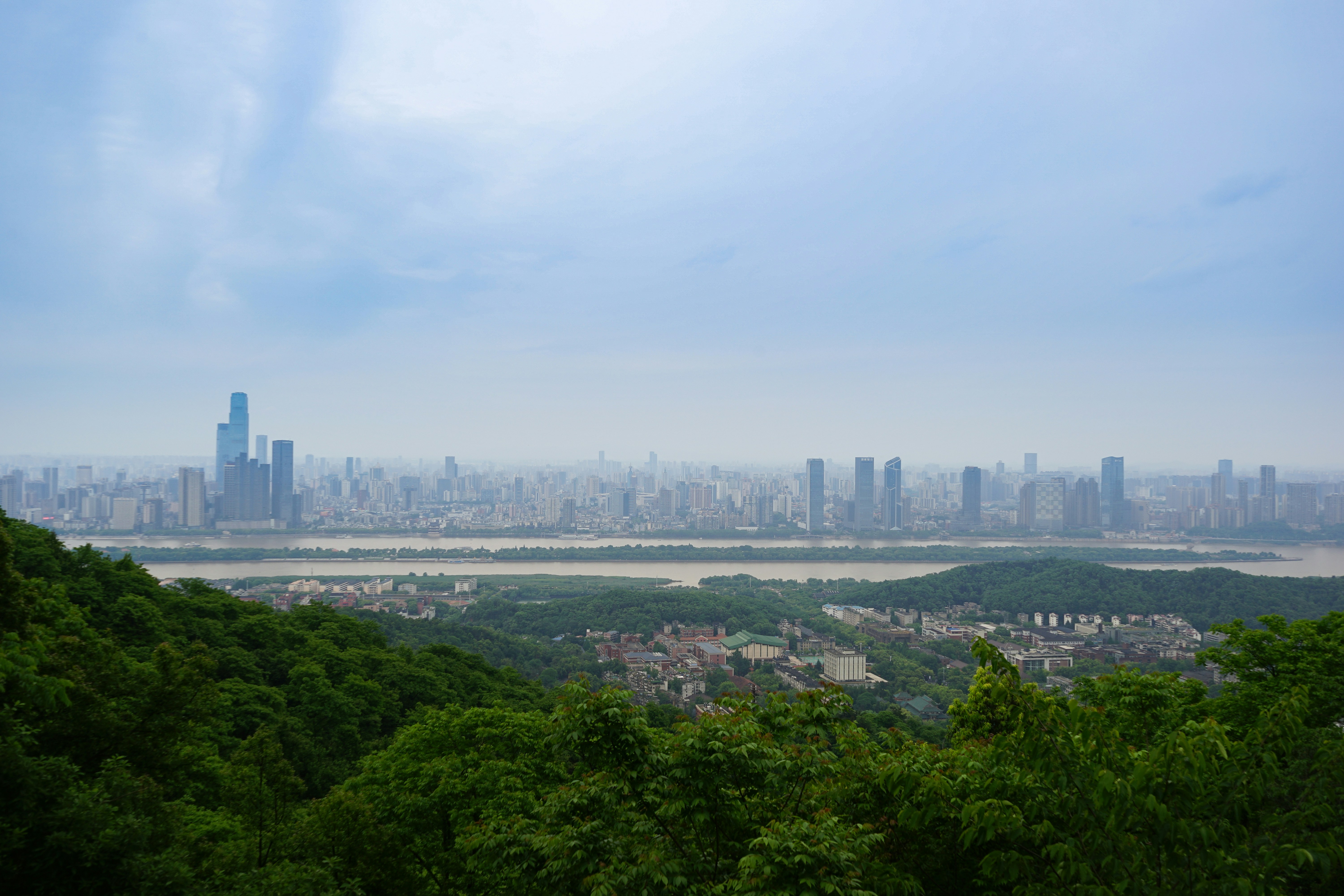 From Green Slopes to Glass Skyline: A Fold of River and City