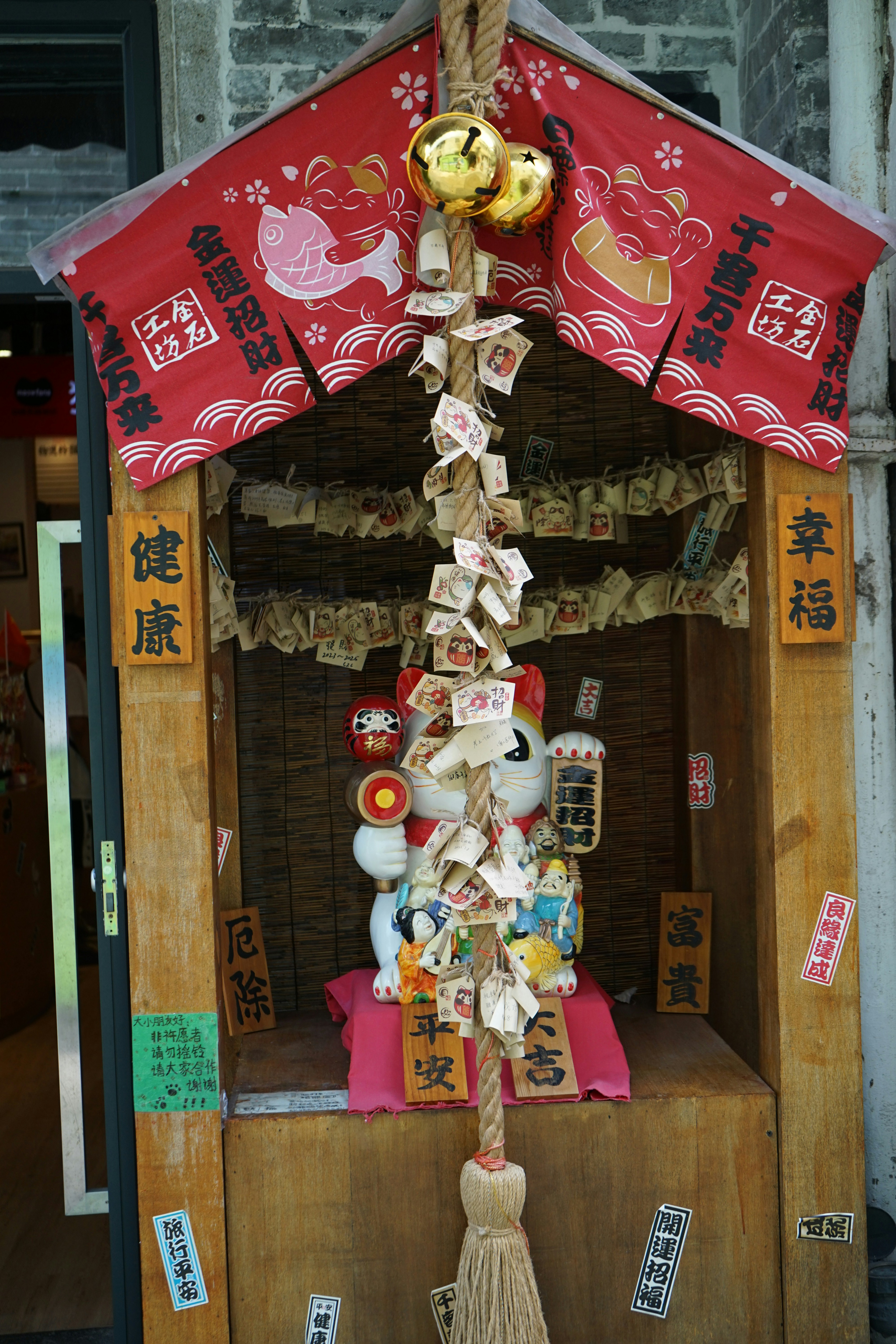 Talisman Shrine: Hanging Ema and Lucky Figures in a wooden Shinto-inspired Shrine