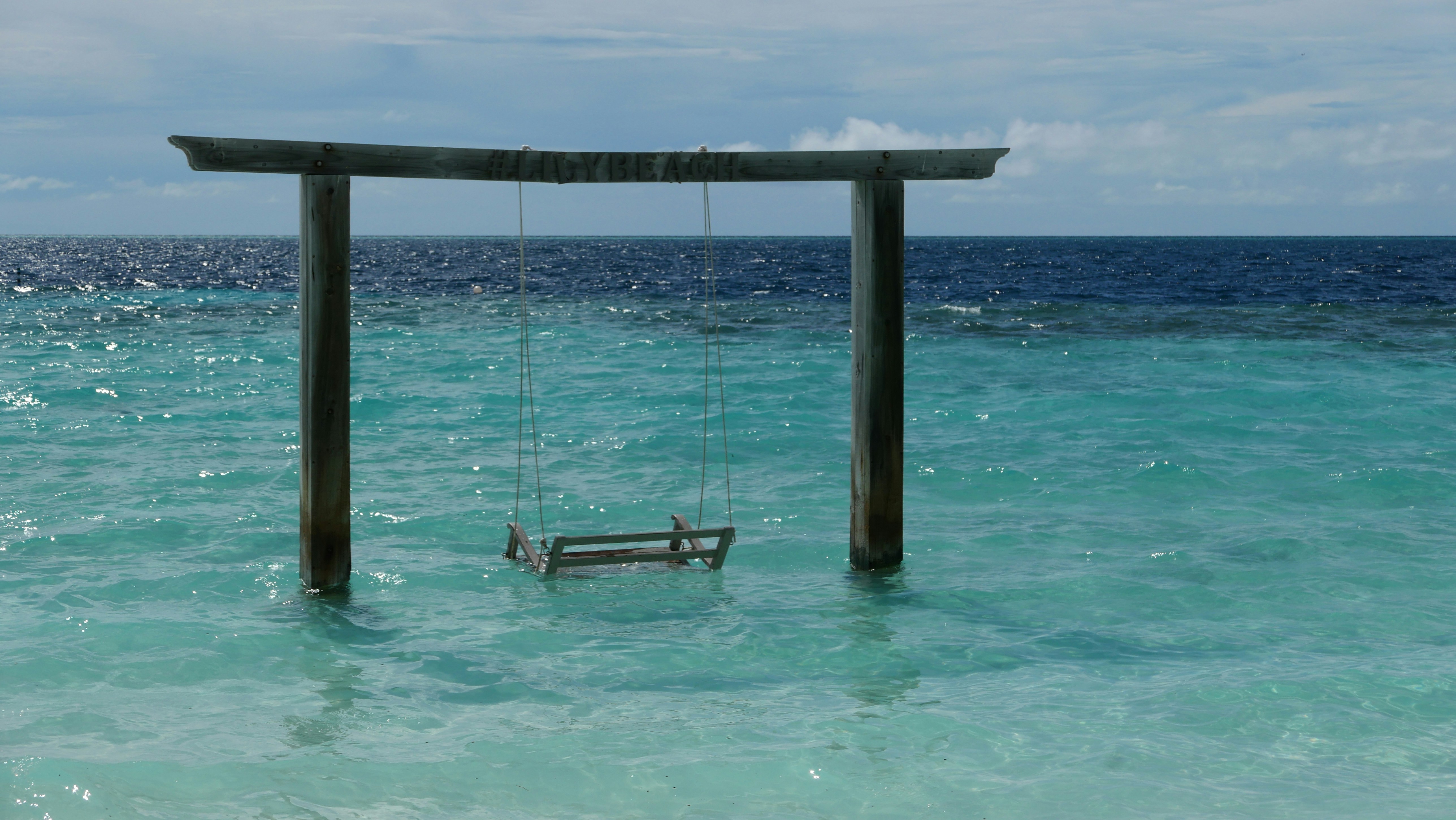 Solitary Swing Over Turquoise Seas