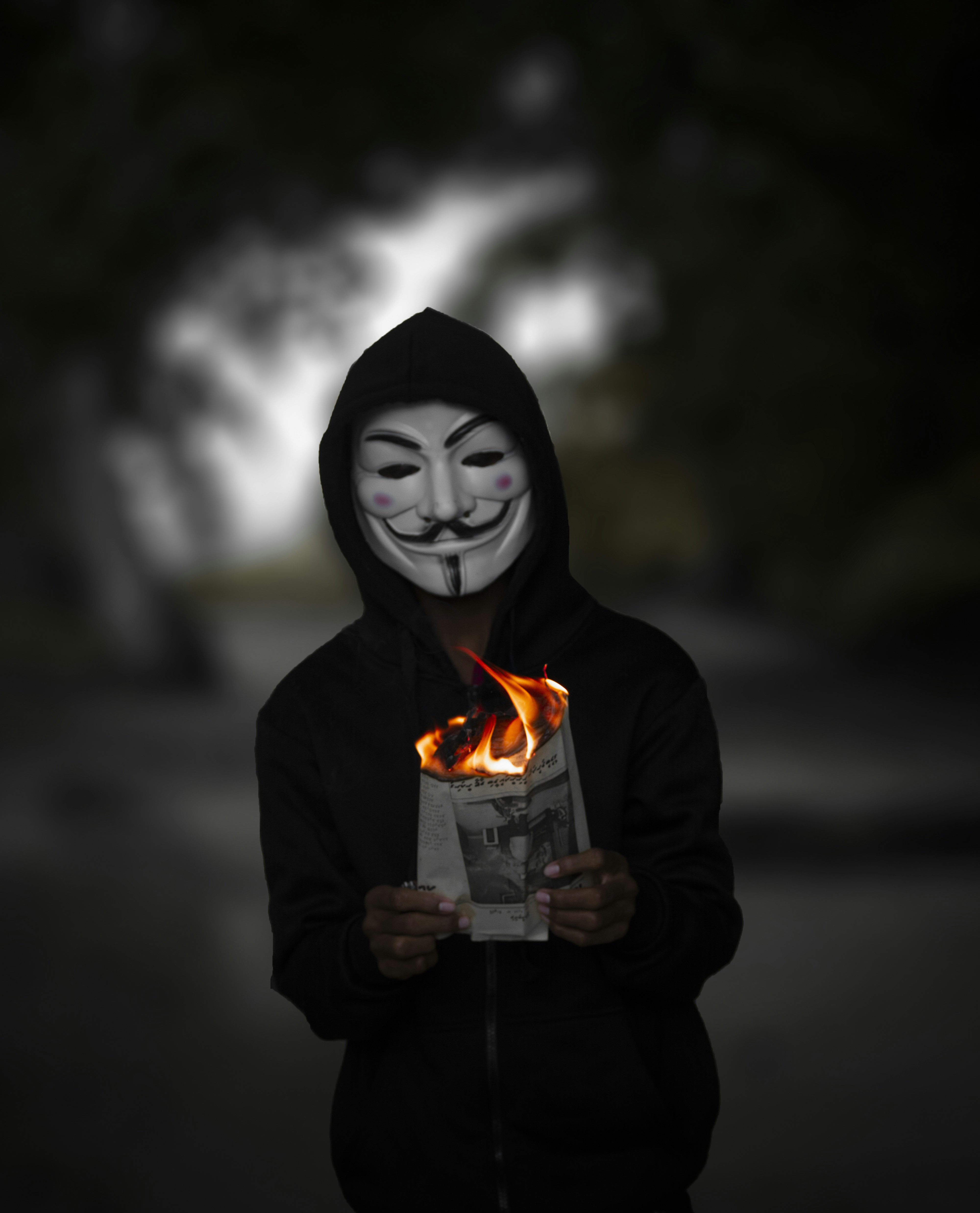 Anonymous Flame: a masked figure with a burning memory
